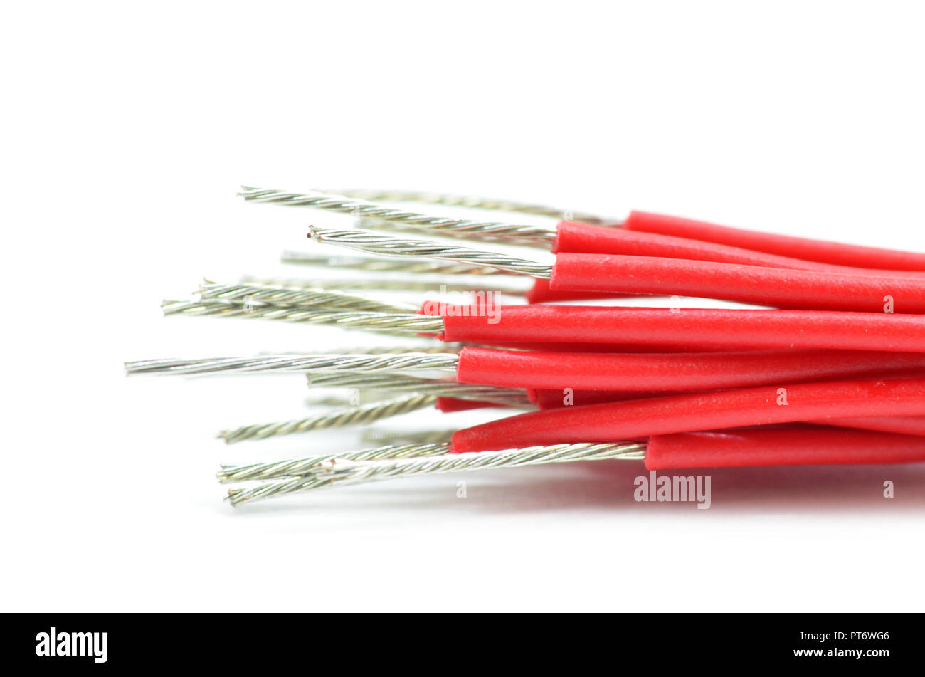 Bunch of red wires on a white background Stock Photo - Alamy
