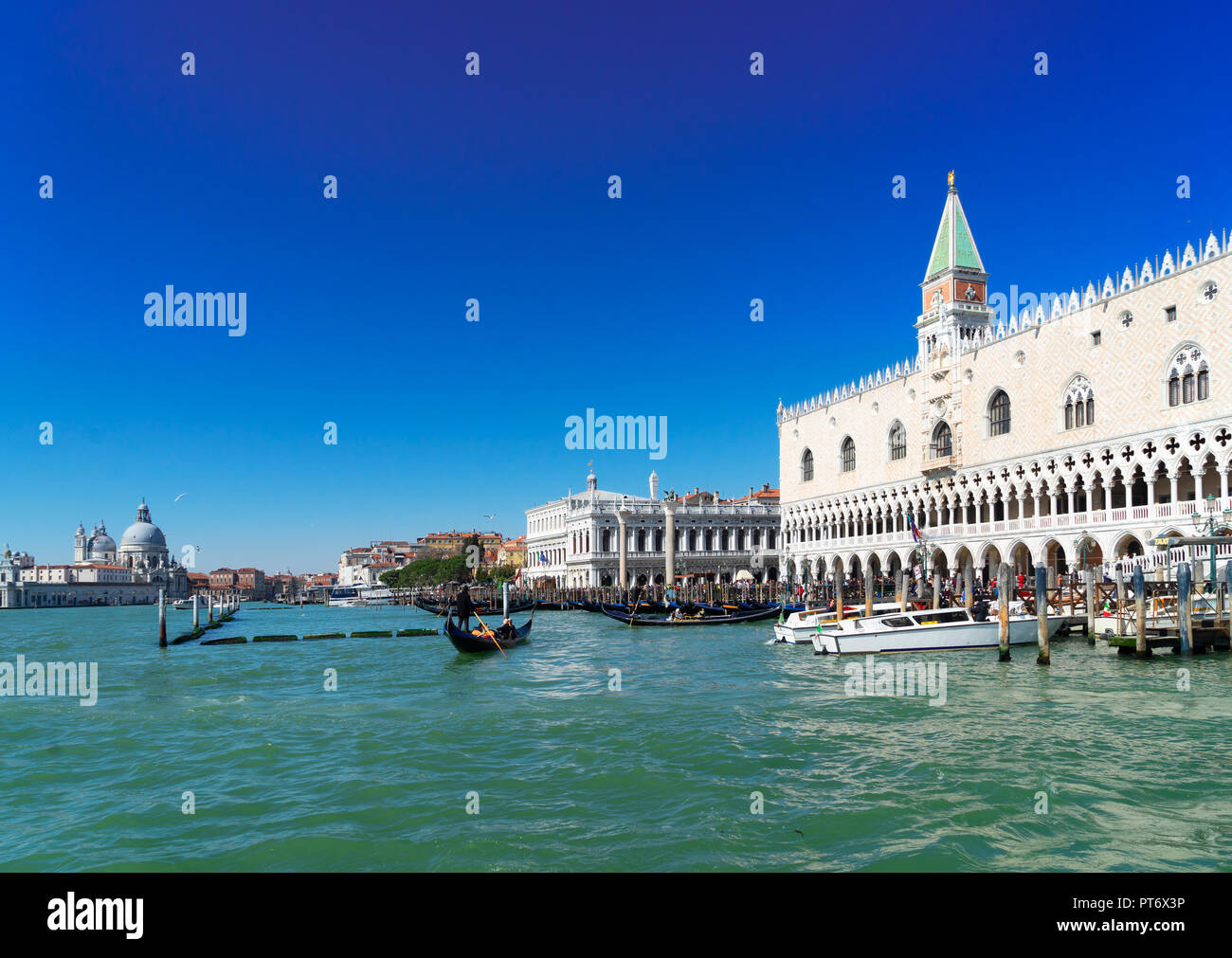 Palace of Doges at San Marco embankment and Lagoon water, Venice, Italy ...