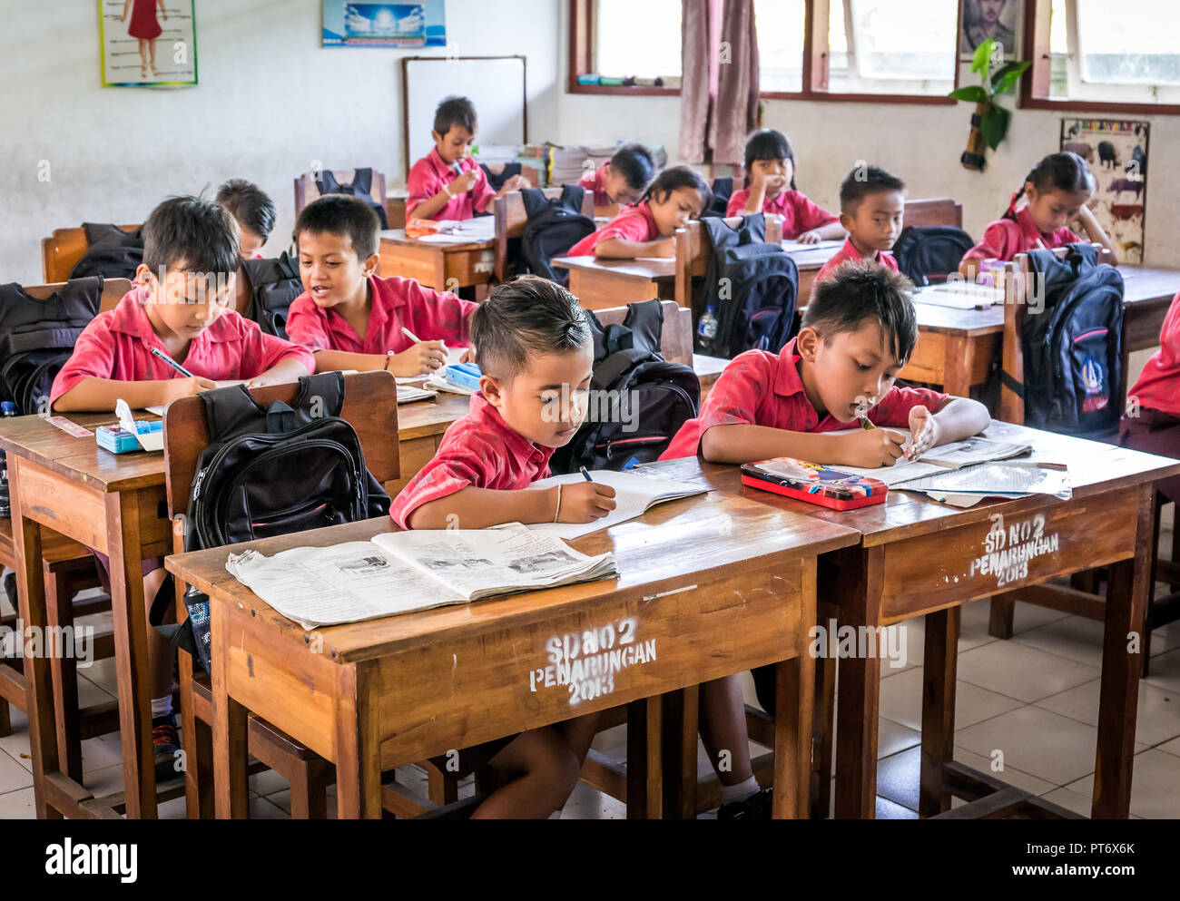 BALI, INDONESIA - APRIL 25, 2018: Young happy pupils wearing balinese ...