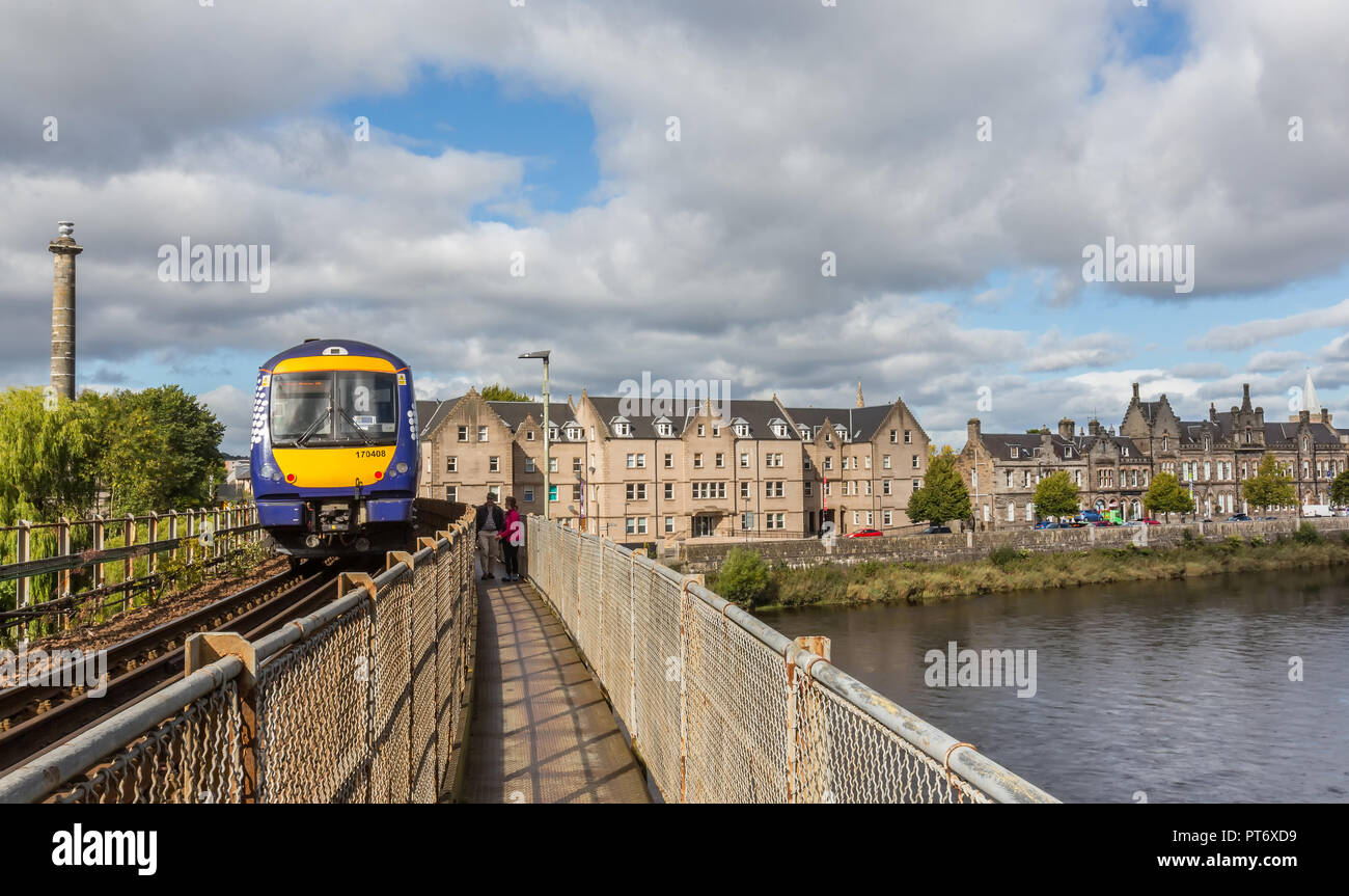 A train crosses the River Tay on the Friarton Bridge in the city of ...