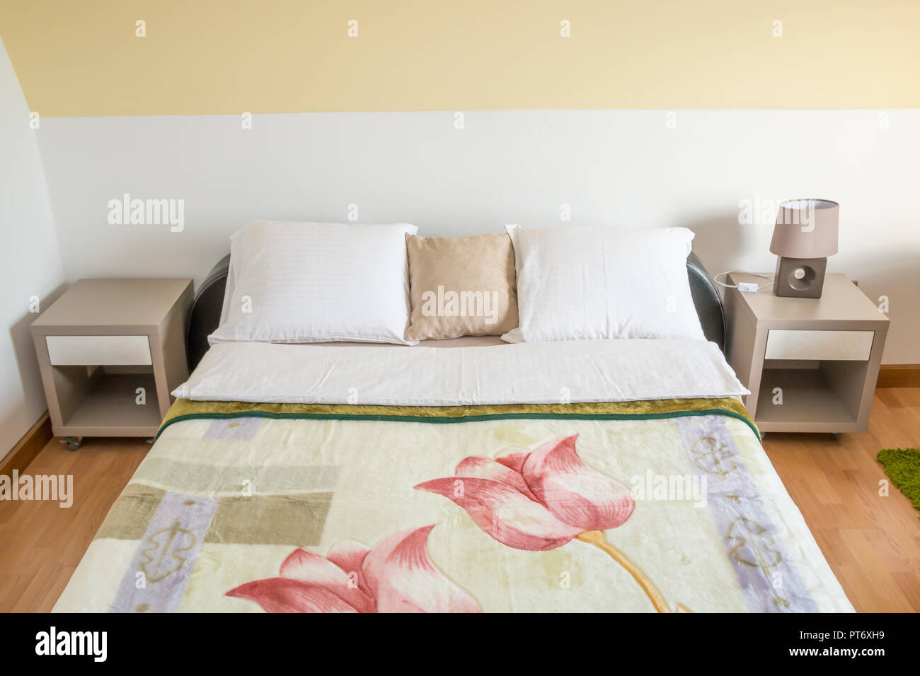 Front side of double bed. Modern hotel bedroom interior. Close up Stock ...