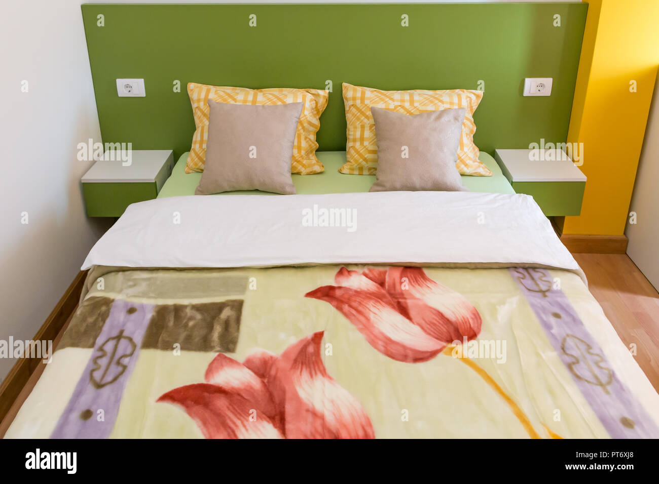 Front side of double bed. Modern hotel bedroom interior. Close up Stock ...