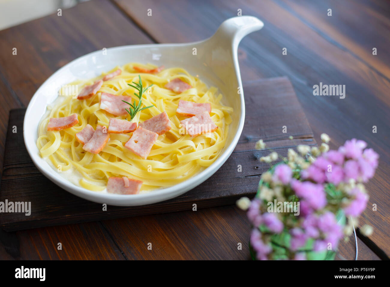 Pasta carbonara on complex background Stock Photo - Alamy