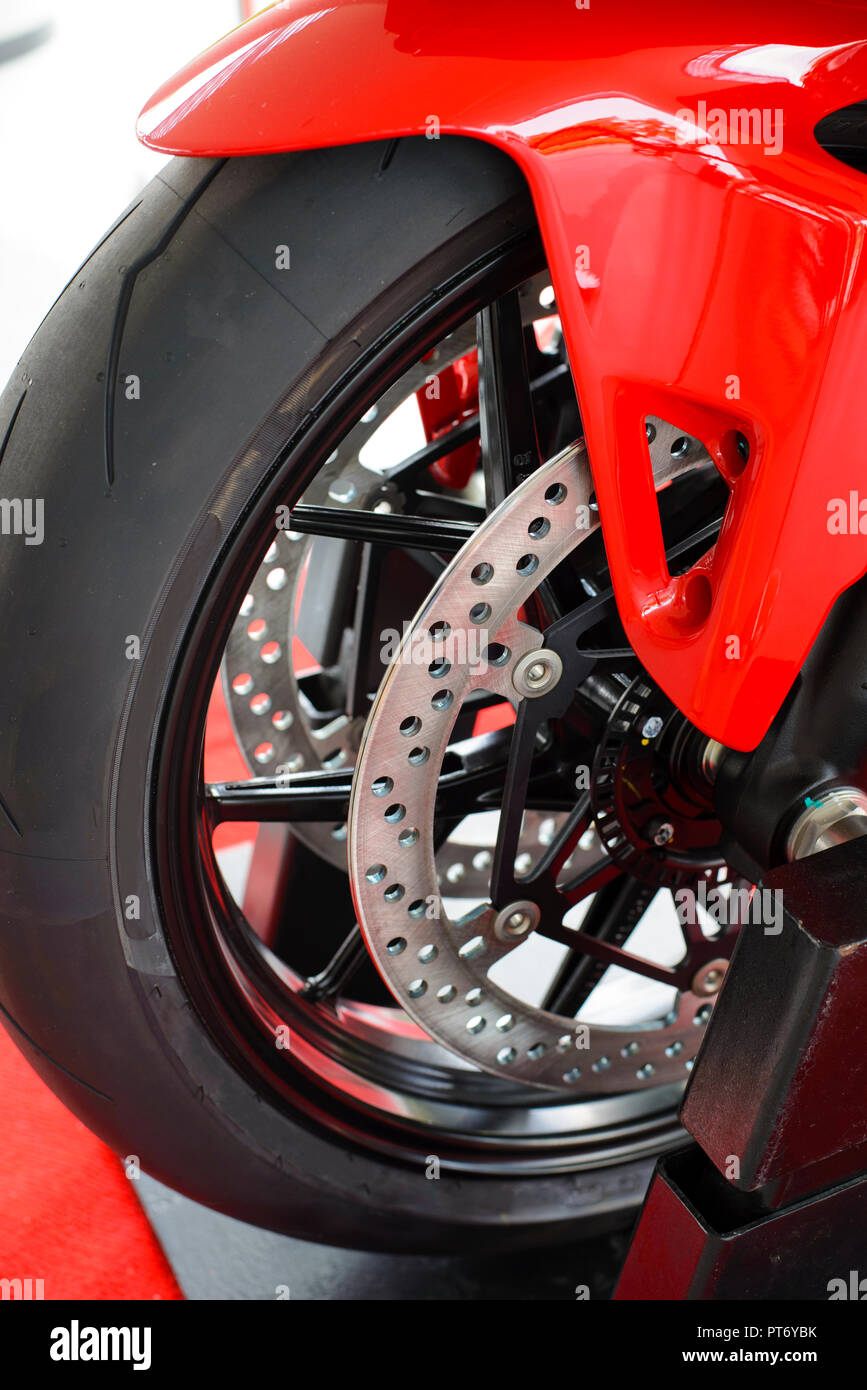 Front wheel and twin brake disc of racing motorcycle on a stands case ...