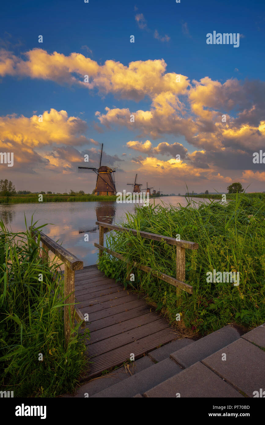 Sunset above old dutch windmills in Kinderdijk, Netherlands Stock Photo ...