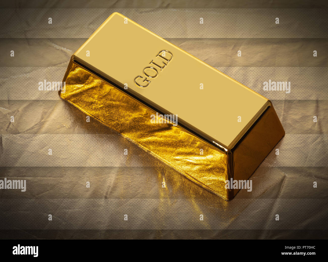 bar of gold close-up on golden background Stock Photo - Alamy