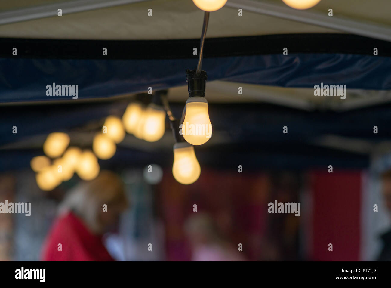 light bulbs on a market stall in the early evening Stock Photo - Alamy