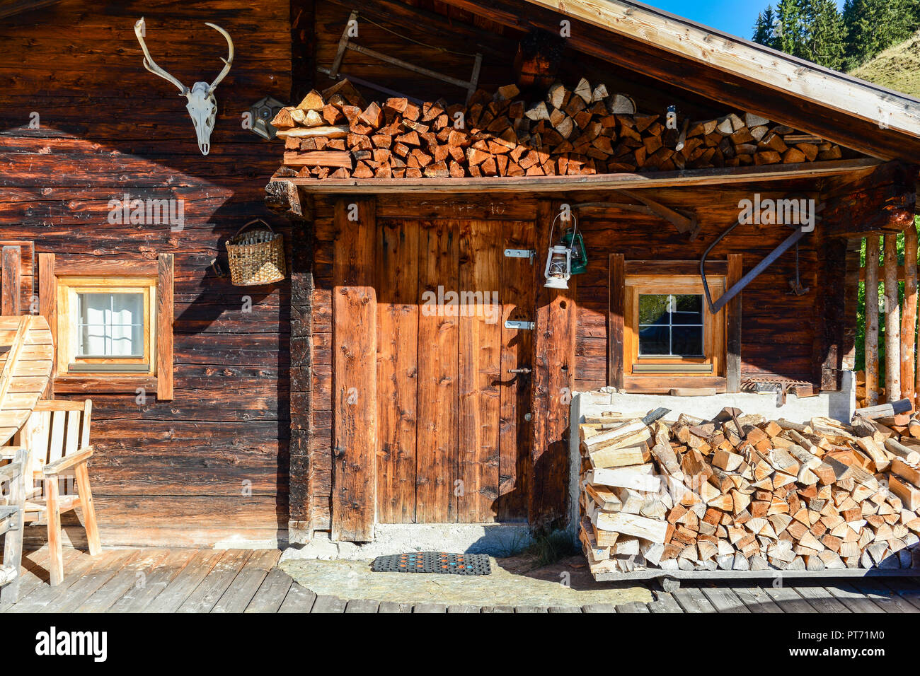 Entrance door to old wooden cabin at mountain meadow in the austrian ...