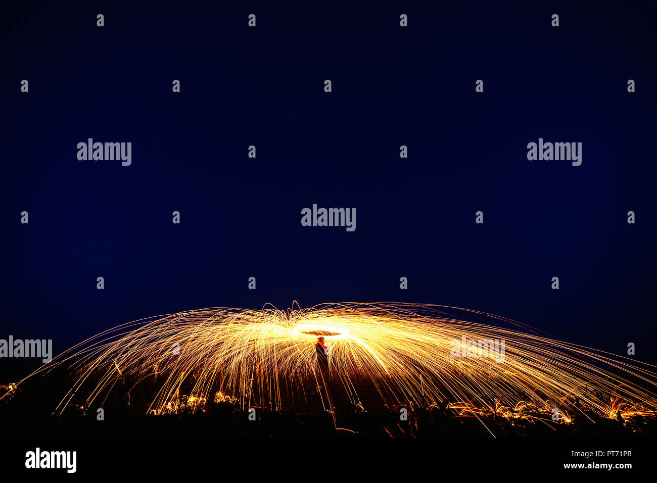 amazing fire show at night at festival or wedding party. Fire dancers ...