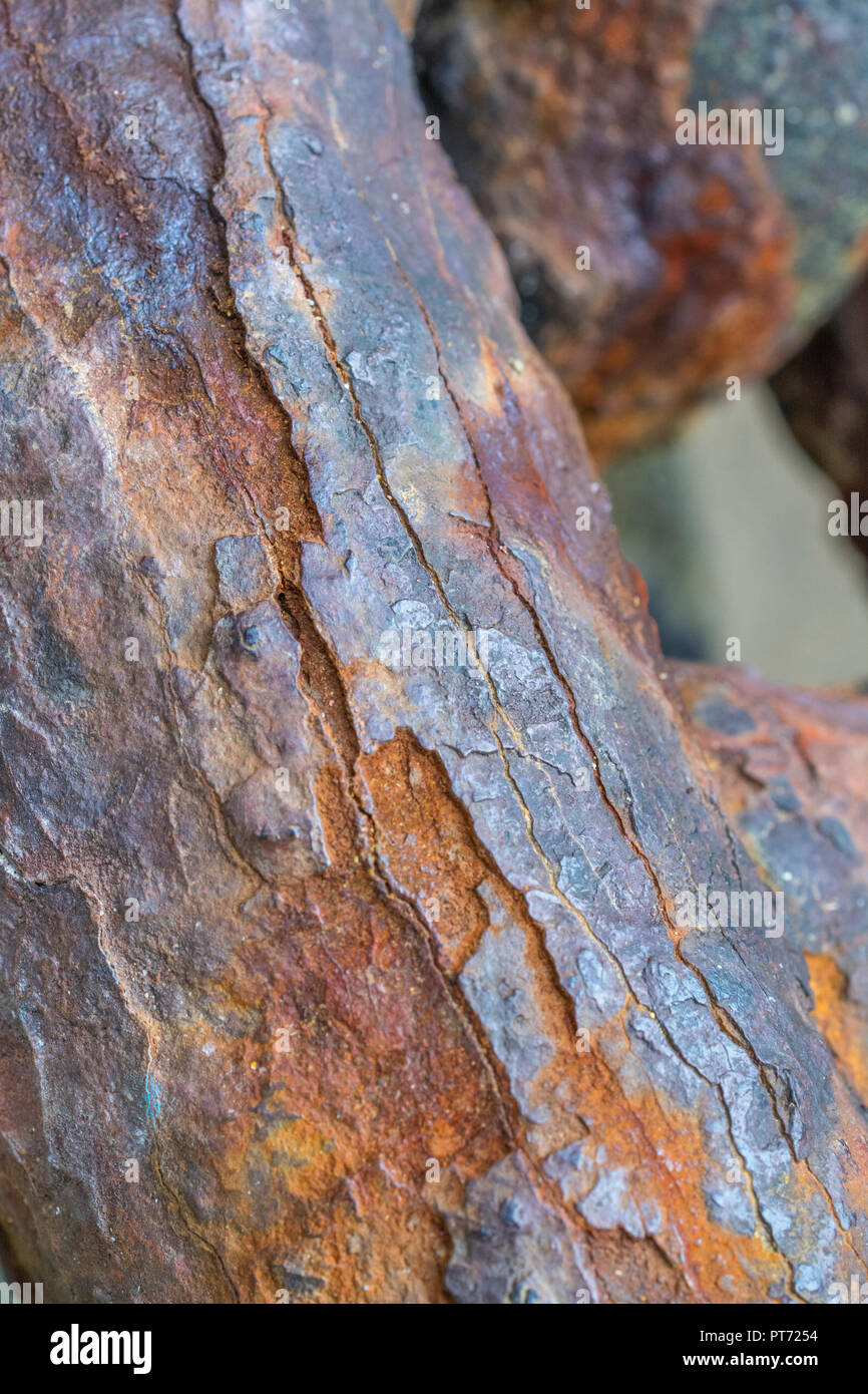 Close-up thick rust encrustation on very heavy duty mooring chain ...