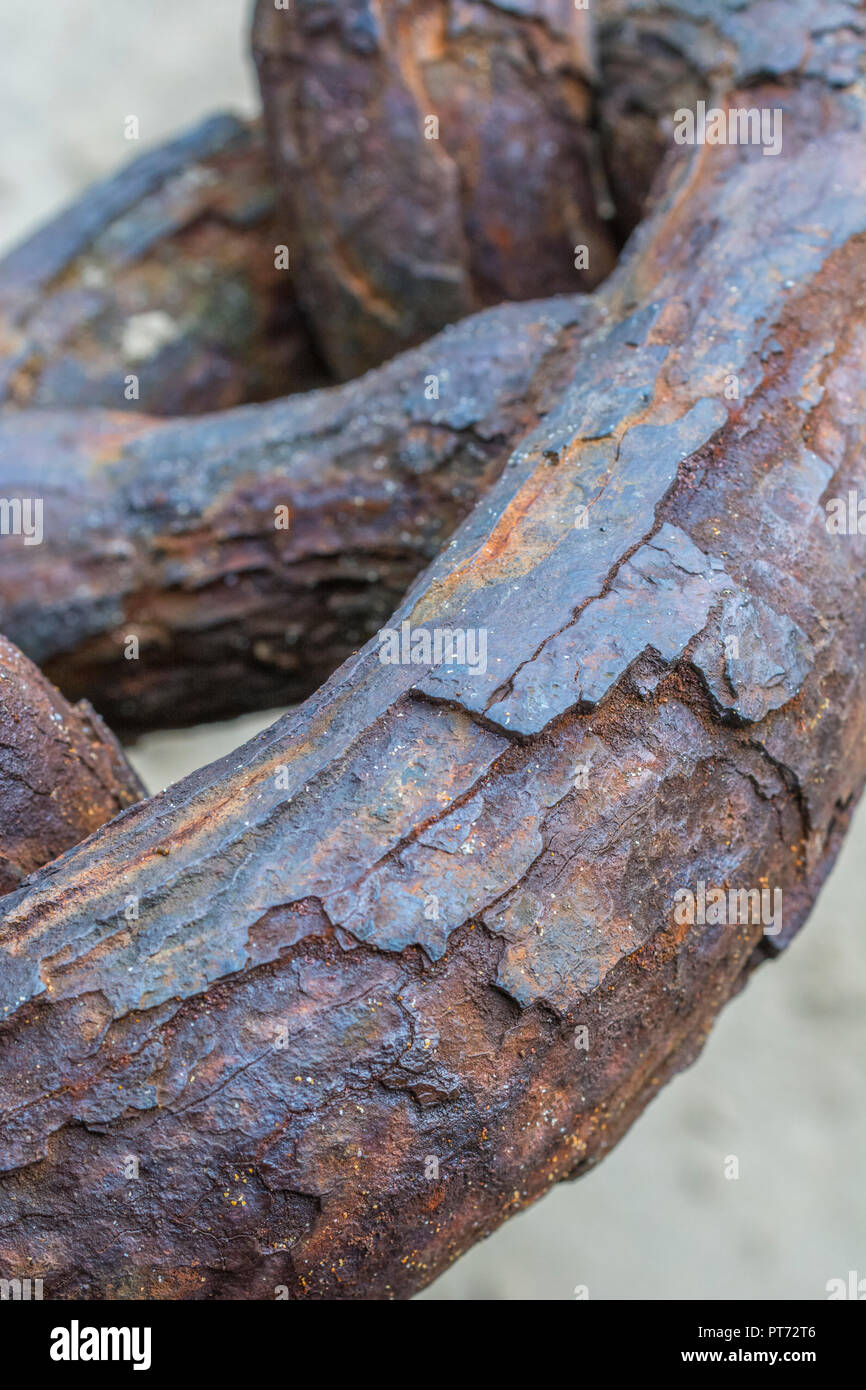 Close-up thick rust encrustation on very heavy duty mooring chain ...