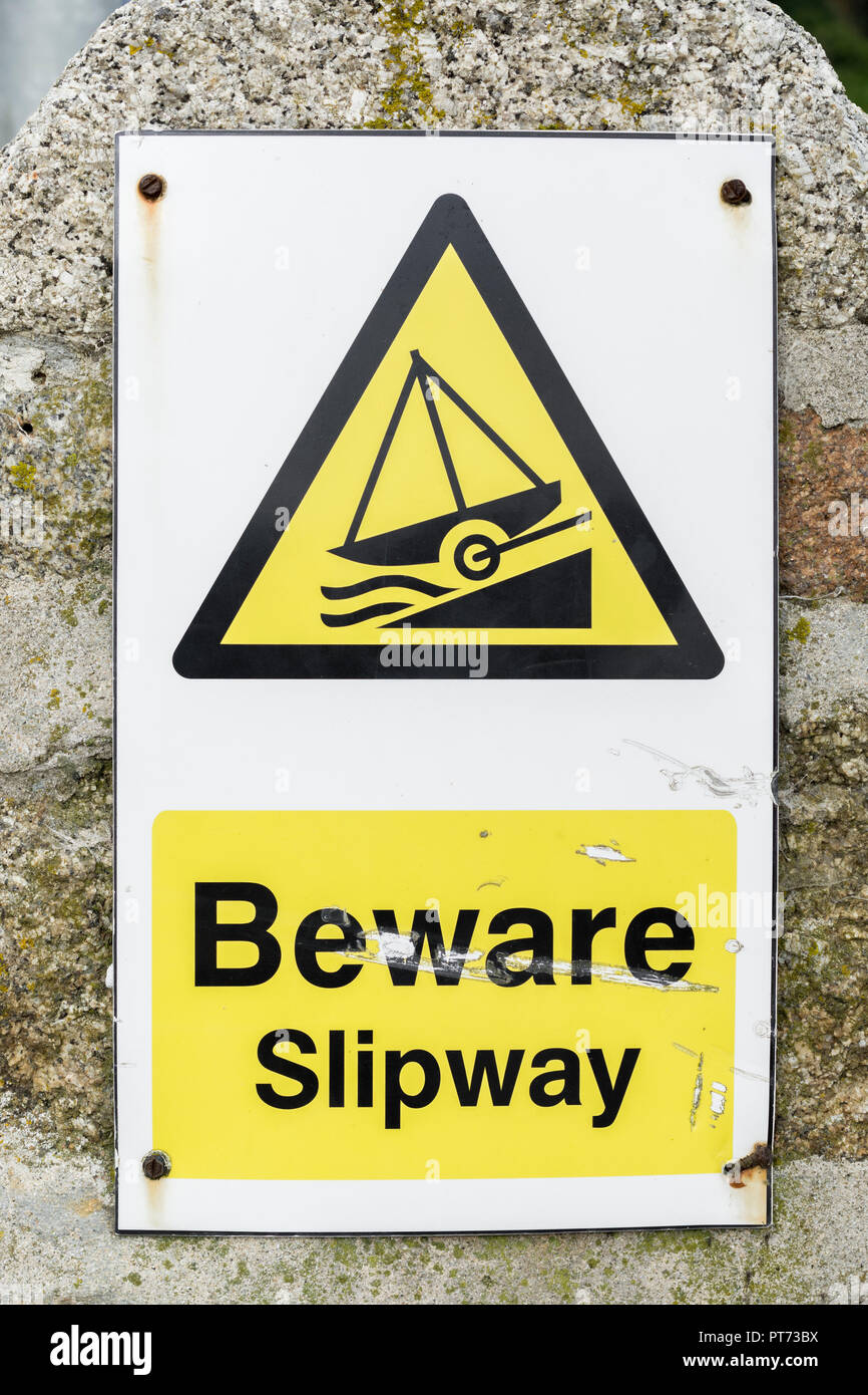 Yellow triangle boat slipway warning sign at Newquay Harbour Stock ...