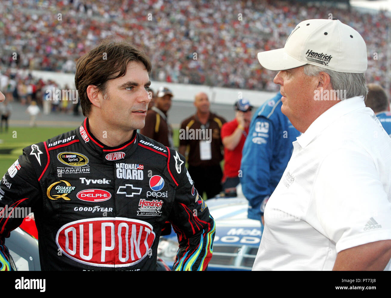 Jeff Gordon (L) talks with his car owner Rick Hendrick prior to the ...