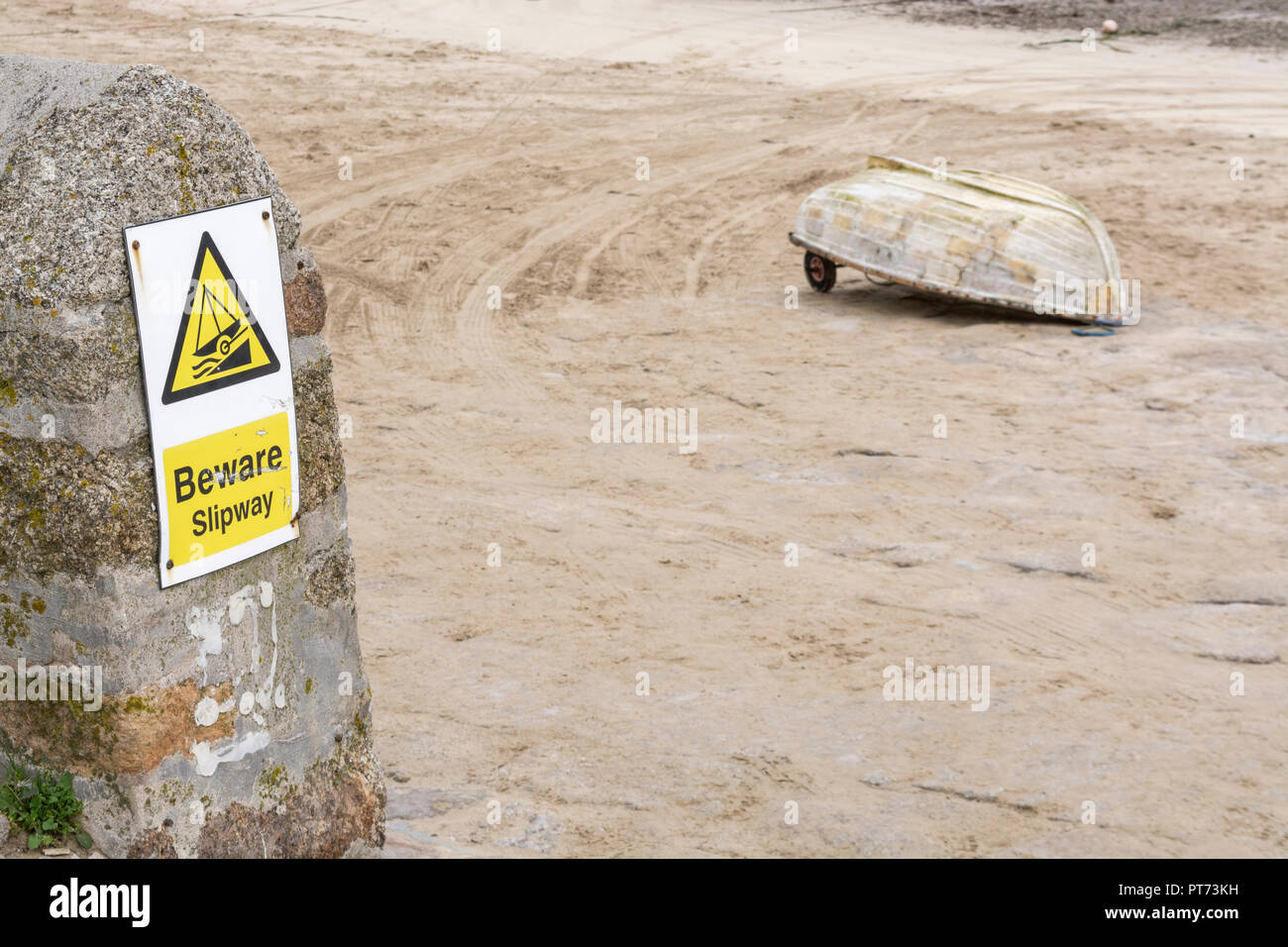 Yellow triangle boat slipway warning sign at Newquay Harbour Stock ...