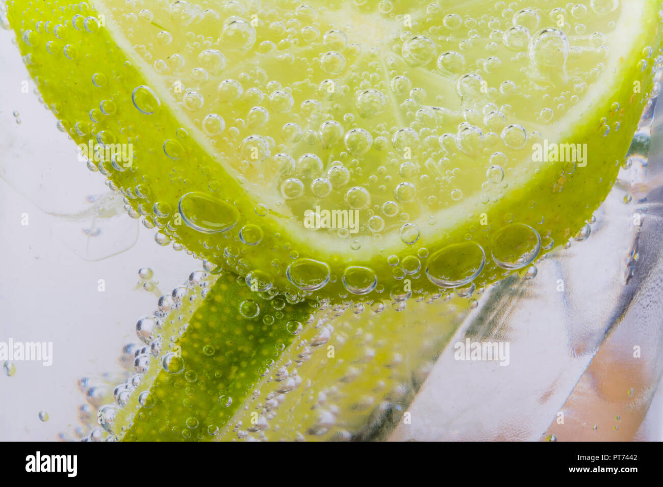 Refreshing fizzy fruit drink with lime and bubbles Stock Photo - Alamy