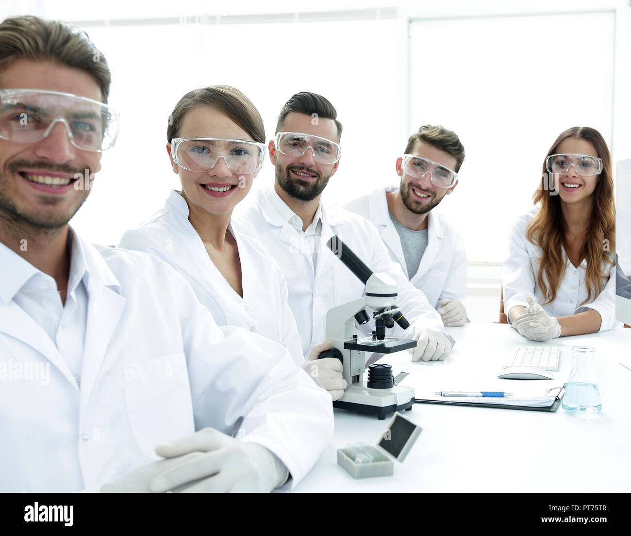 Male scientist and the team in the lab Stock Photo - Alamy