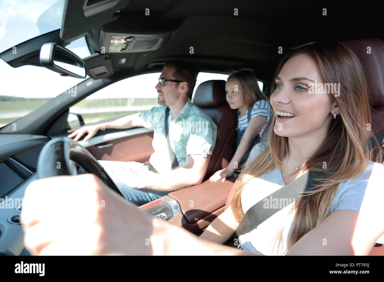 happy mom driving a family car Stock Photo - Alamy