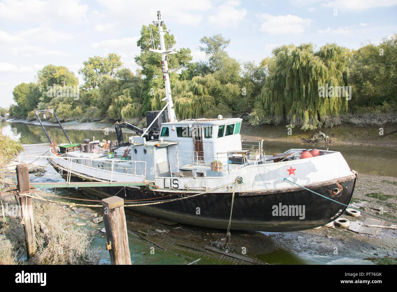 A converted trawler on the river Thames at Watermans Park, near Kew ...