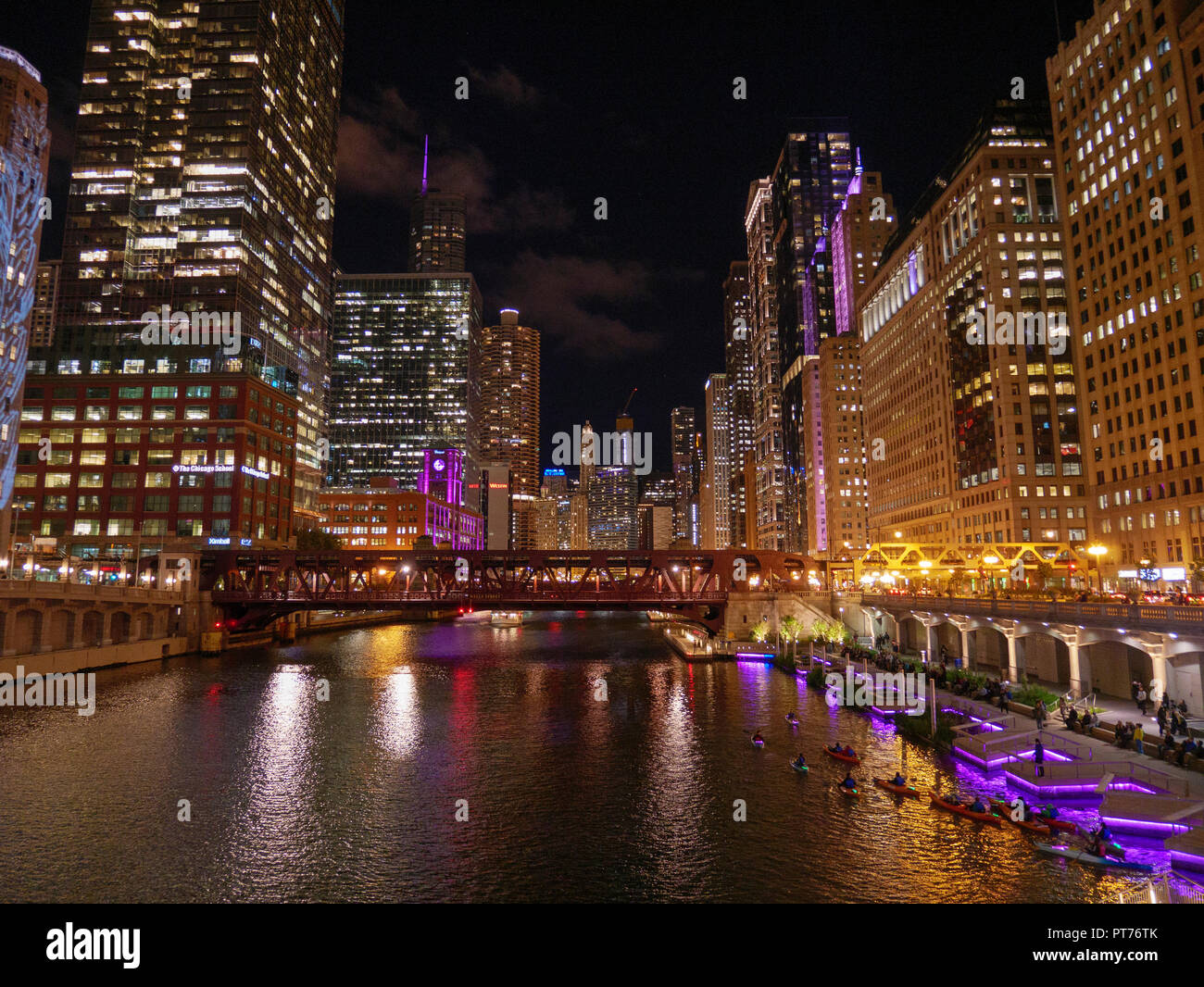 Chicago River night view east from Franklin Street Bridge. Kayakers at ...