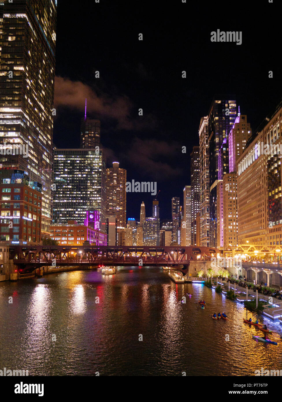 Chicago River night view east from Franklin Street Bridge. Kayakers at ...