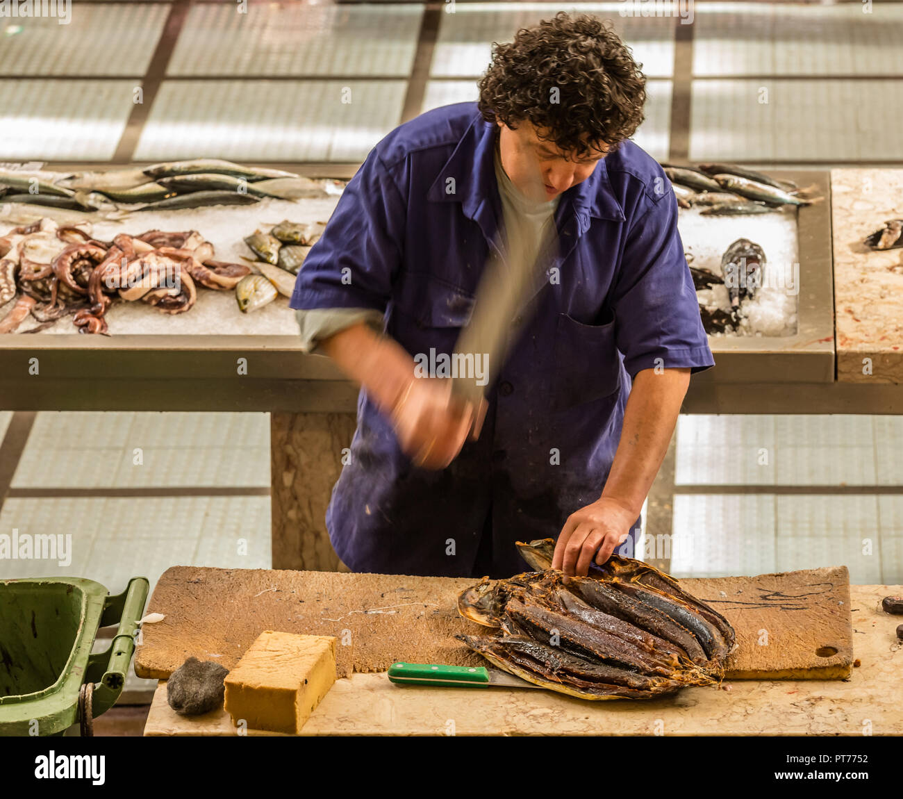 A fisherman selling fish in Funchal market, Madeira Stock Photo - Alamy