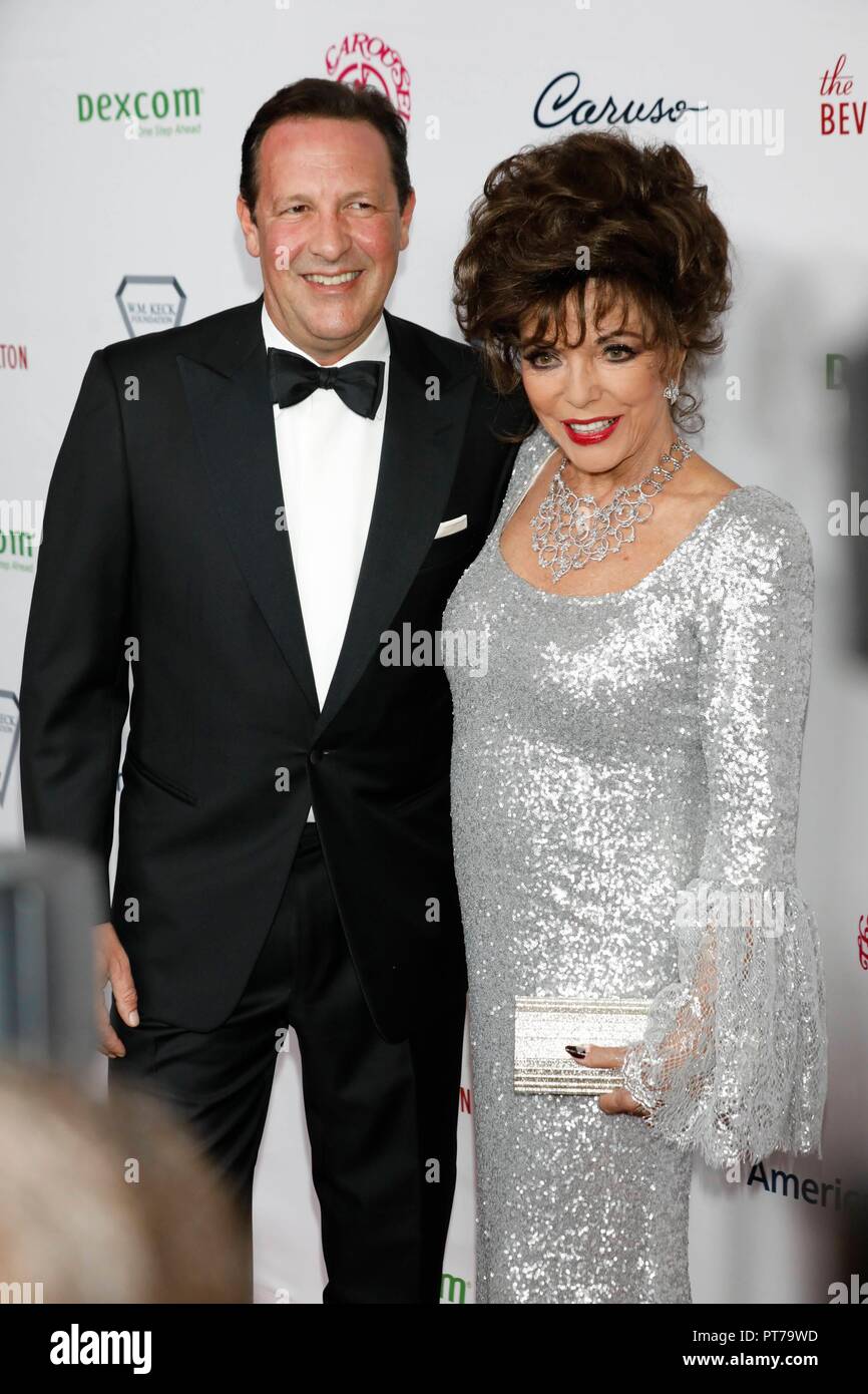 Percy Gibson and Joan Collins attend the Carousel of Hope Ball at The ...