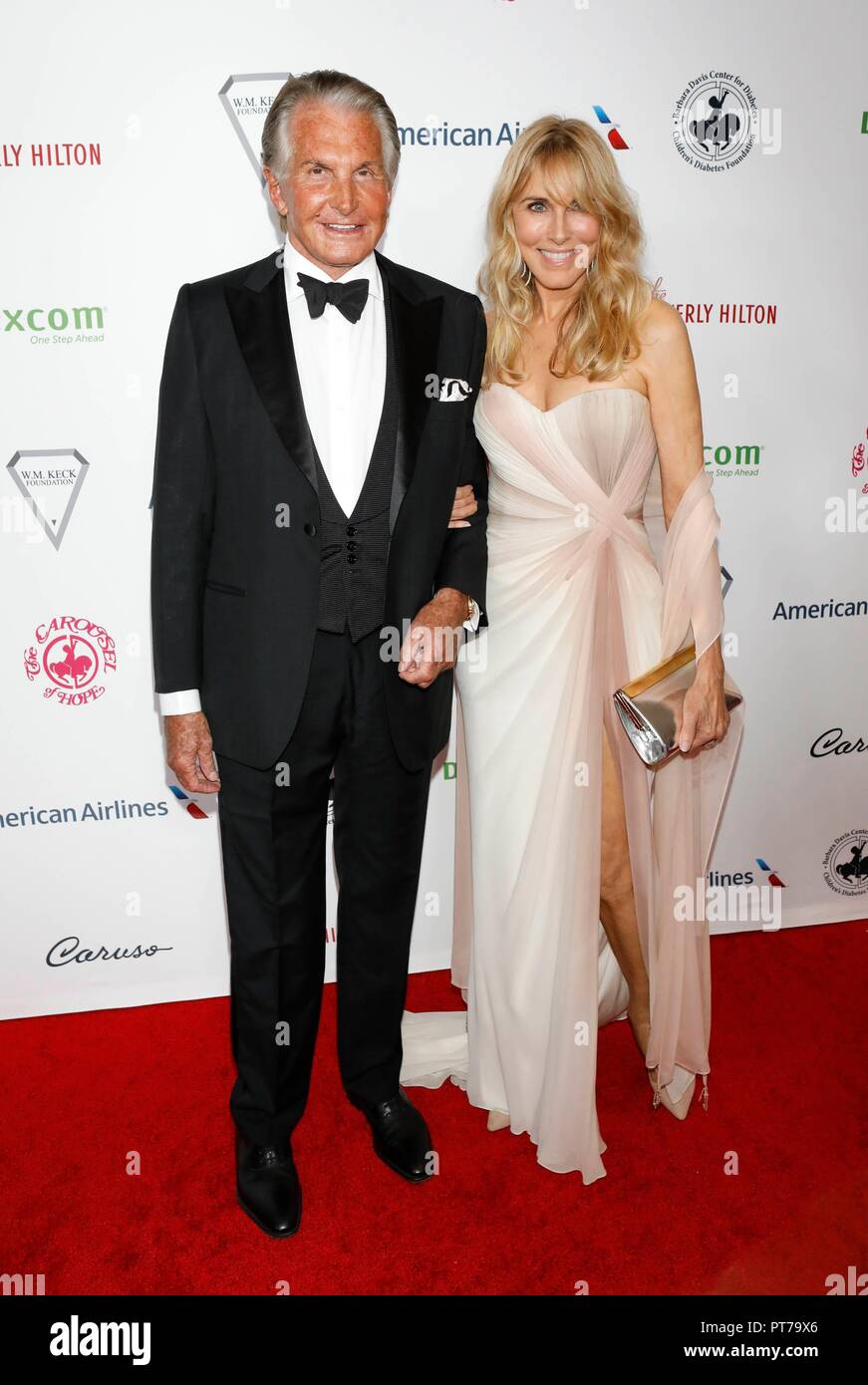 George Hamilton and Alana Steward attend the Carousel of Hope Ball at ...
