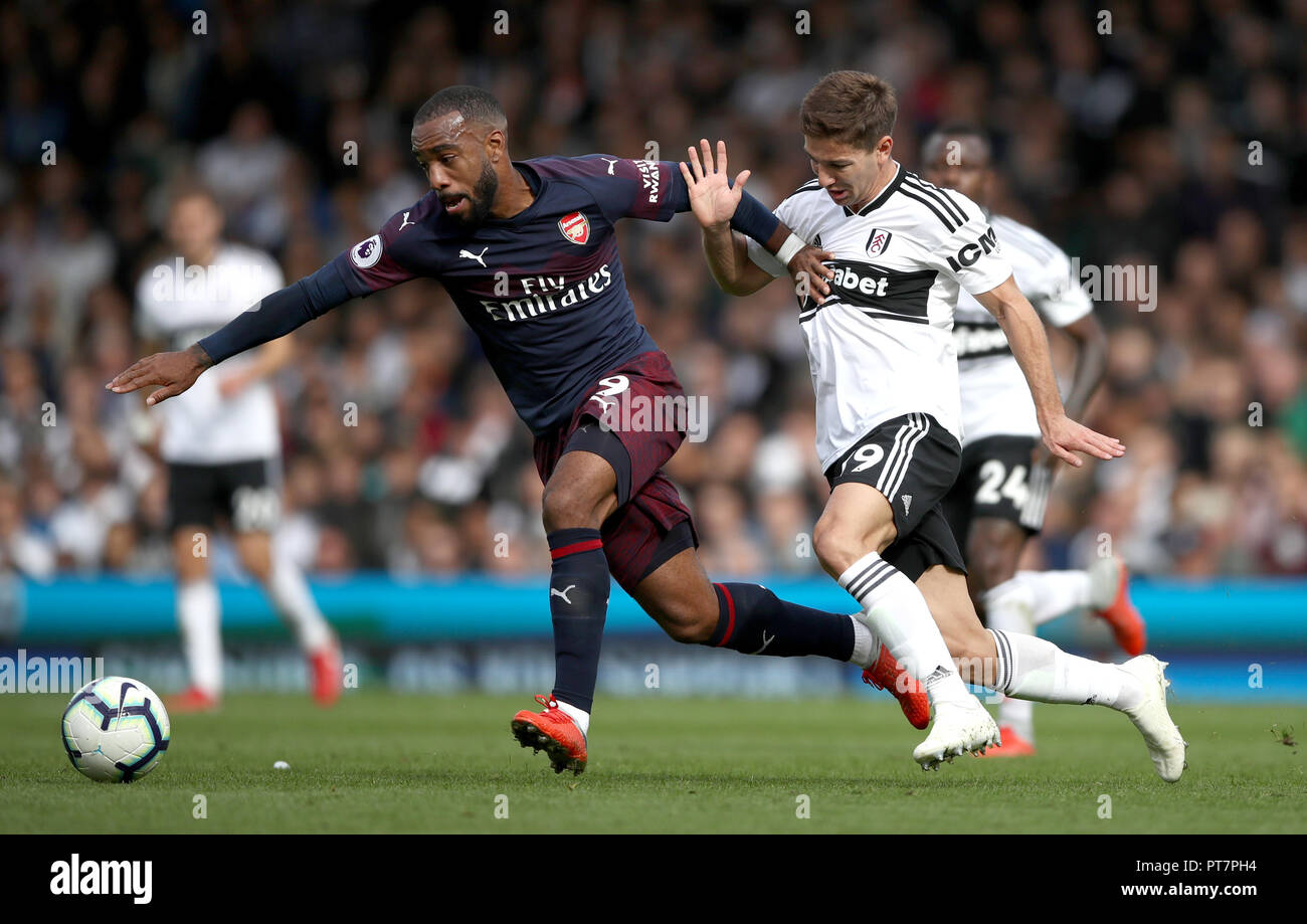 Arsenal's Alexandre Lacazette (left) and Fulham's Luciano Vietto battle ...