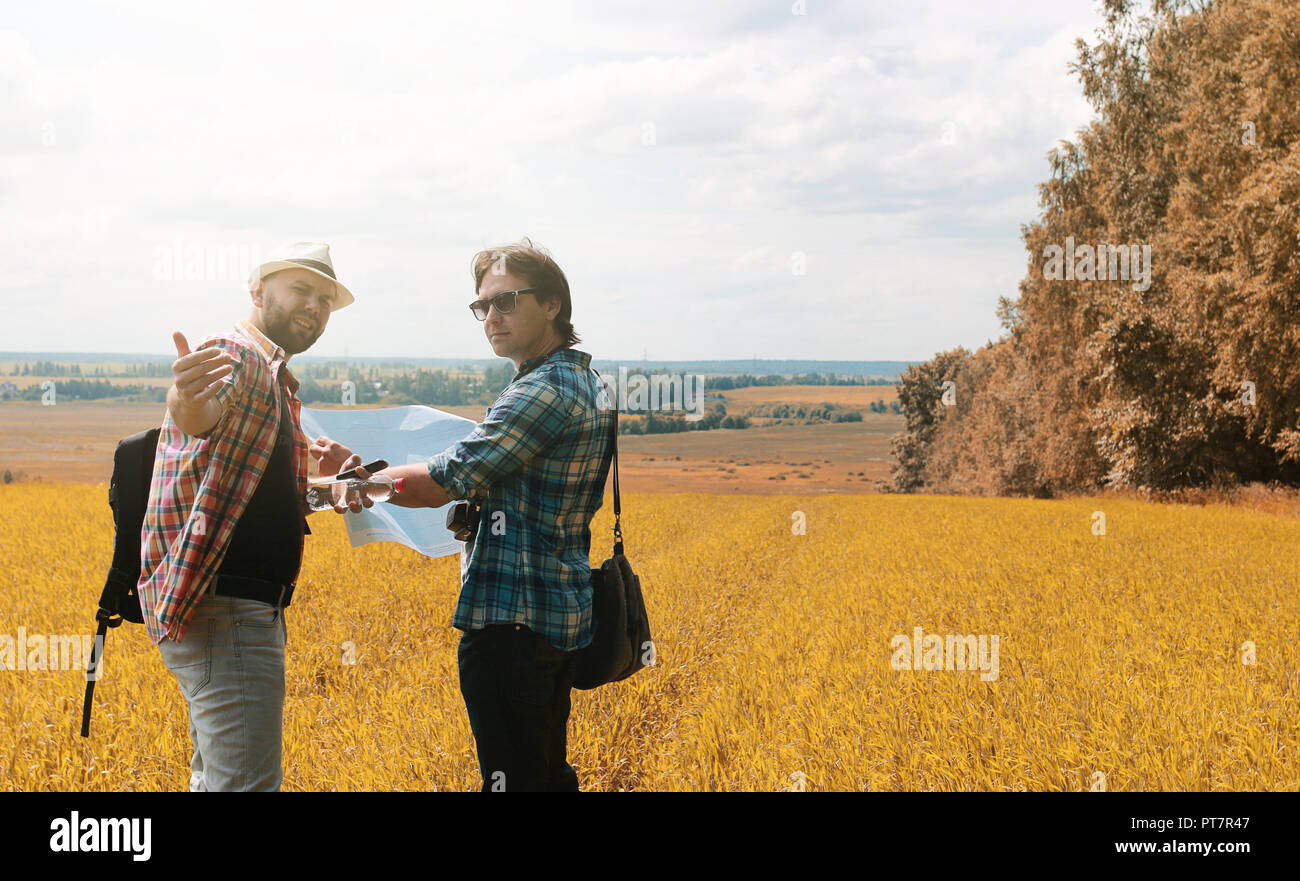 A young man looks at a map Stock Photo - Alamy