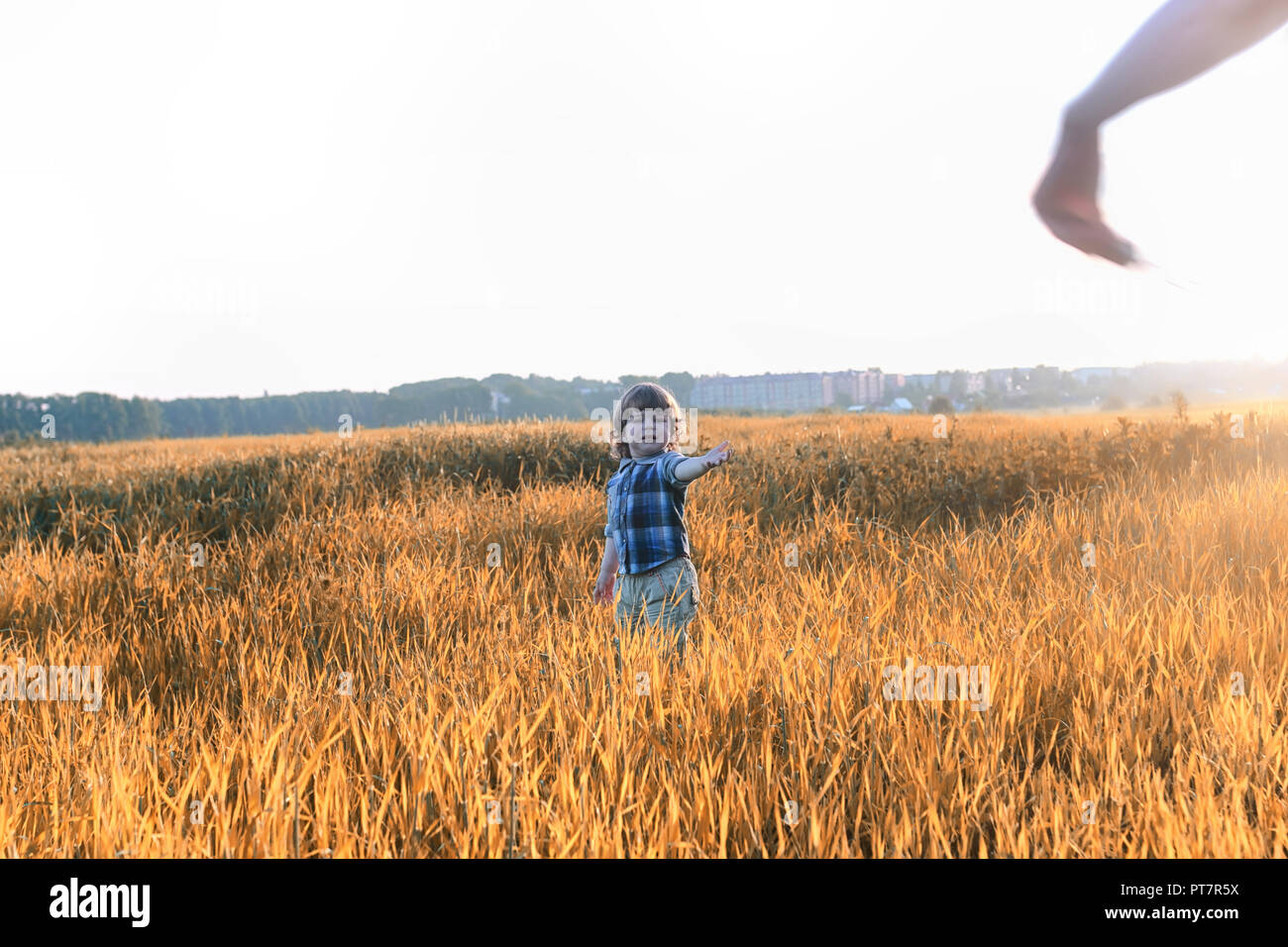 Children outdoors in a field Stock Photo - Alamy