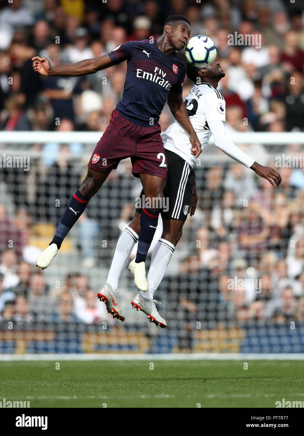 Arsenal's Danny Welbeck (left) and Fulham's Andre-Frank Zambo Anguissa ...