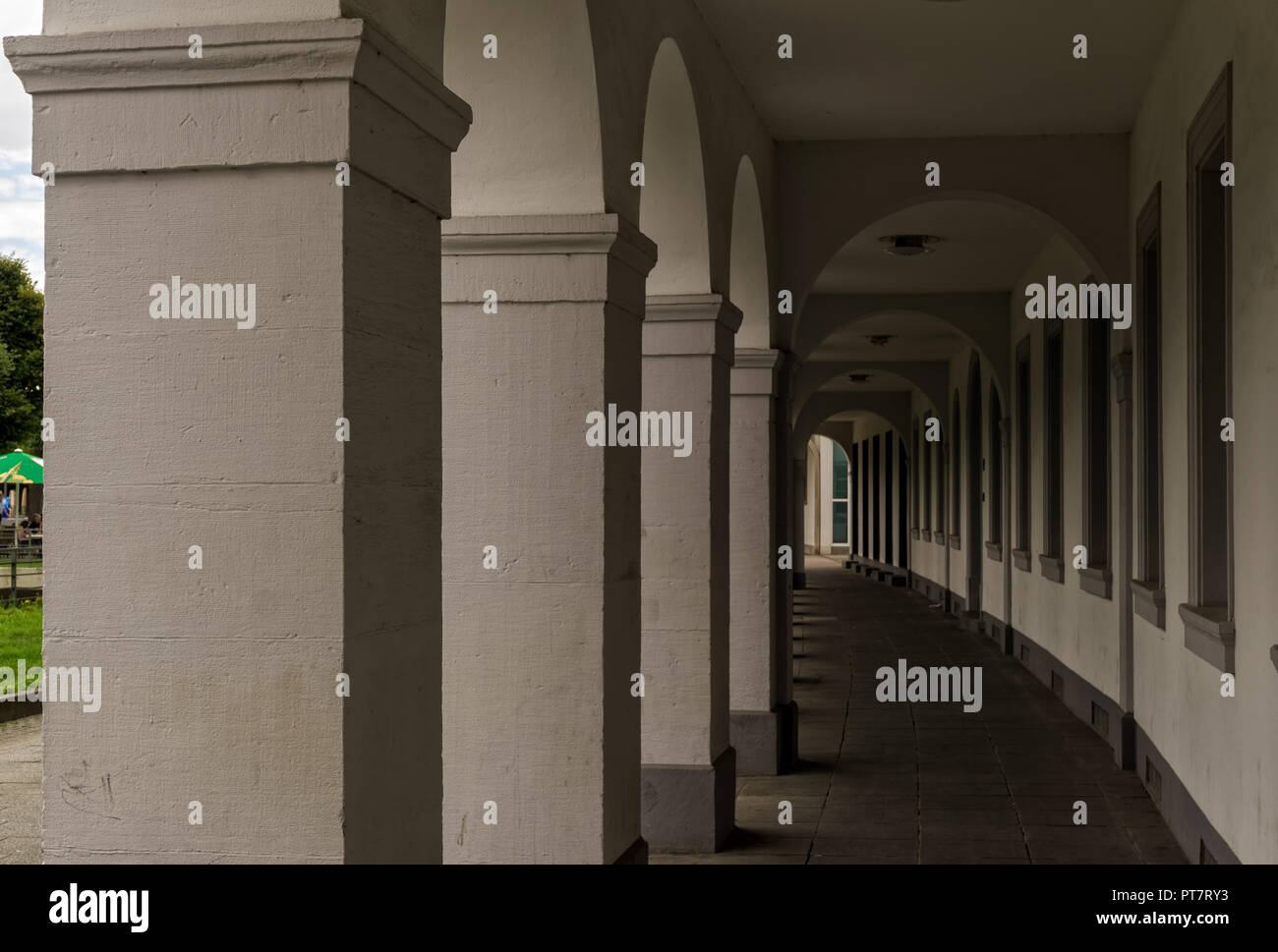The dark outdoor corridor of an old building Stock Photo - Alamy