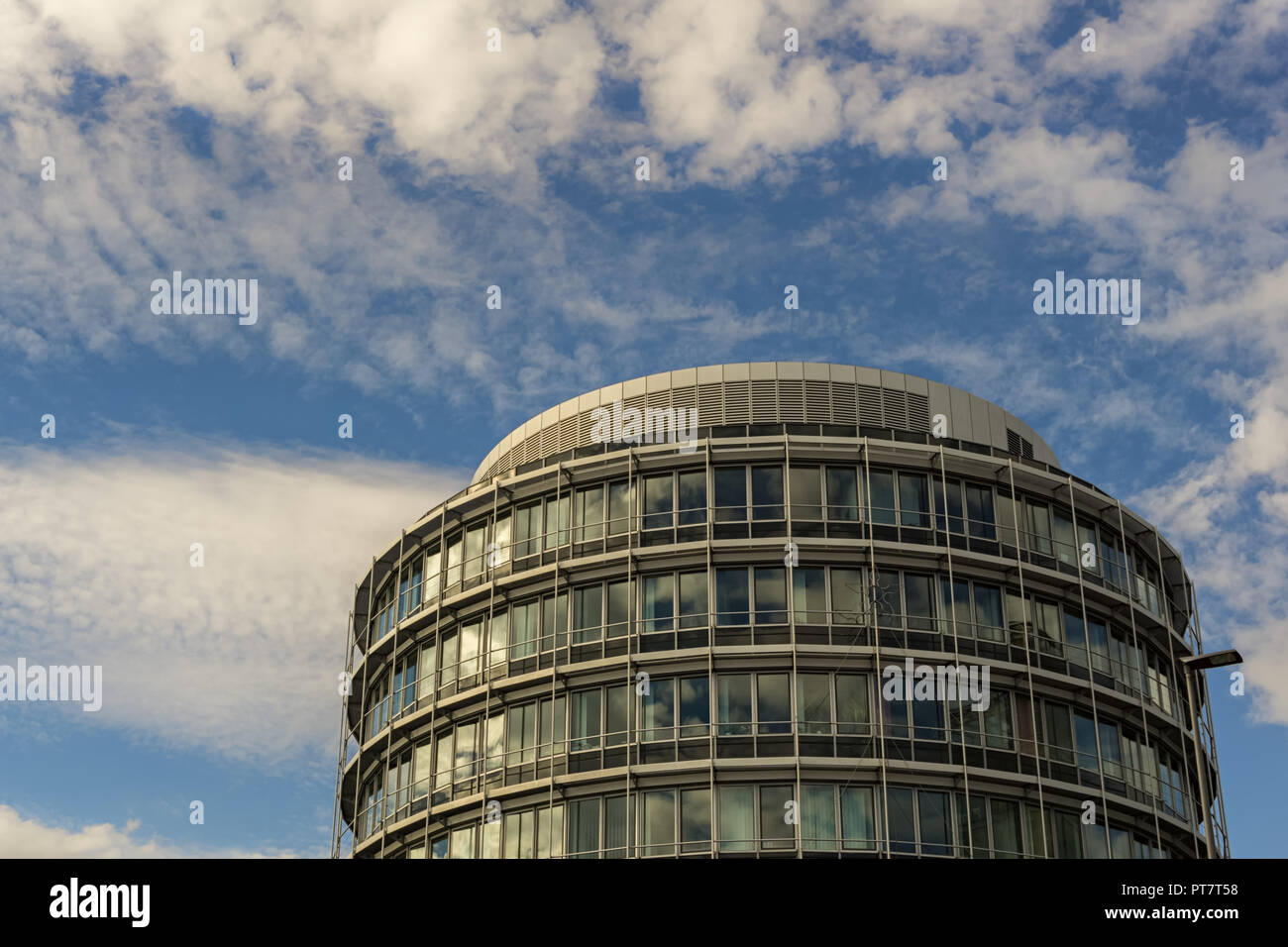 A big,modern office tower in a German city,shot from a public place ...