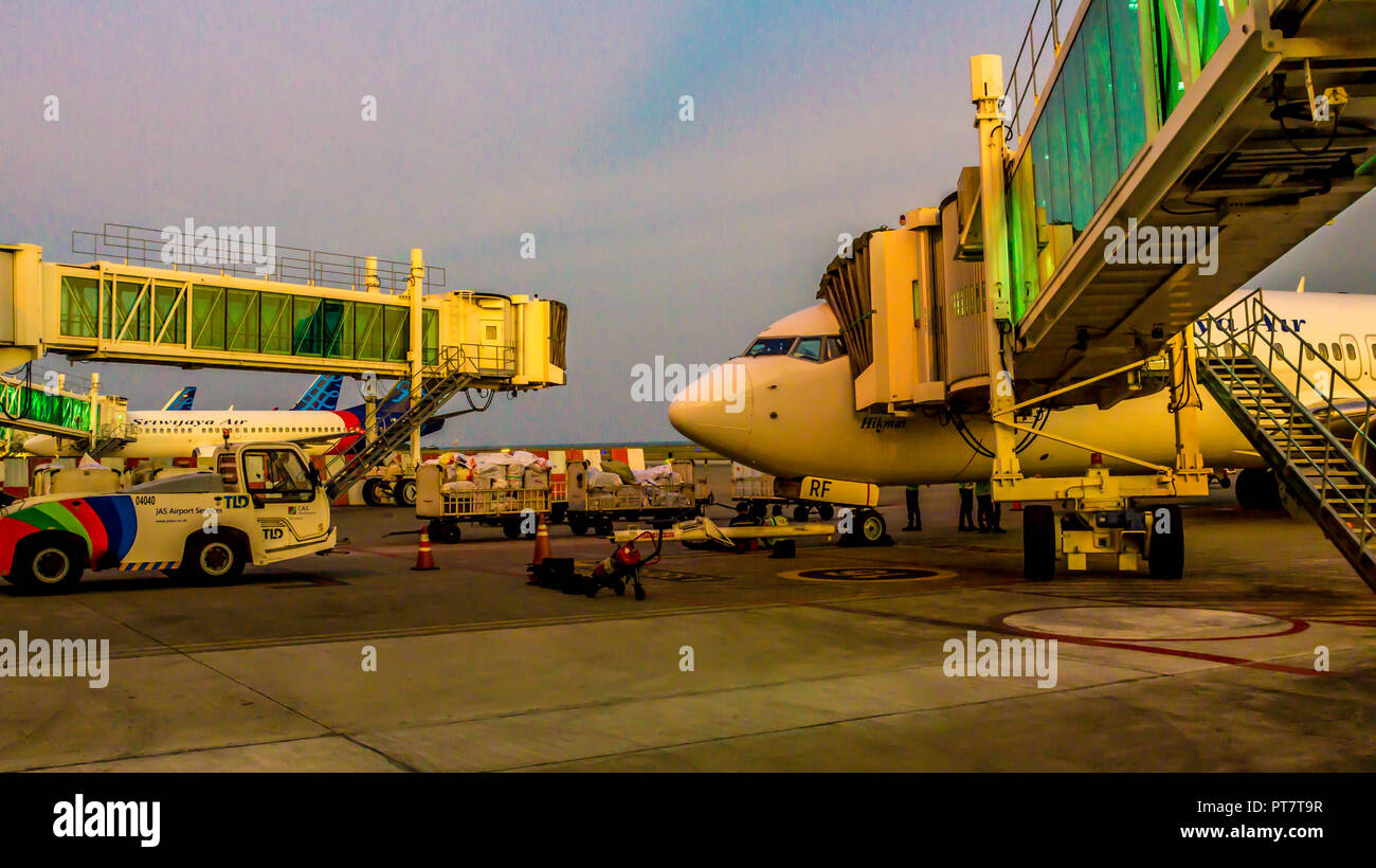 a plane is prepared before take off. boarding passenger, fueling ...