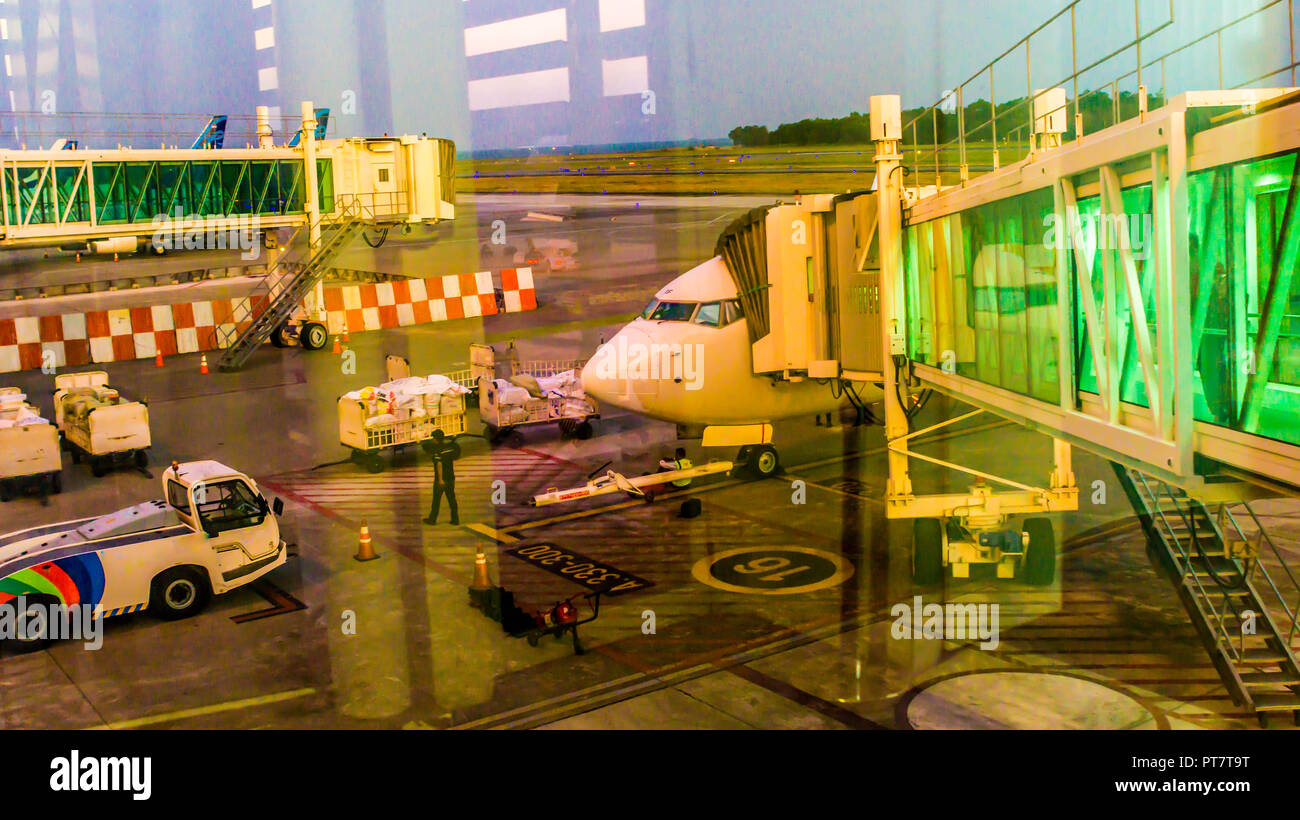 a plane is prepared before take off. boarding passenger, fueling ...
