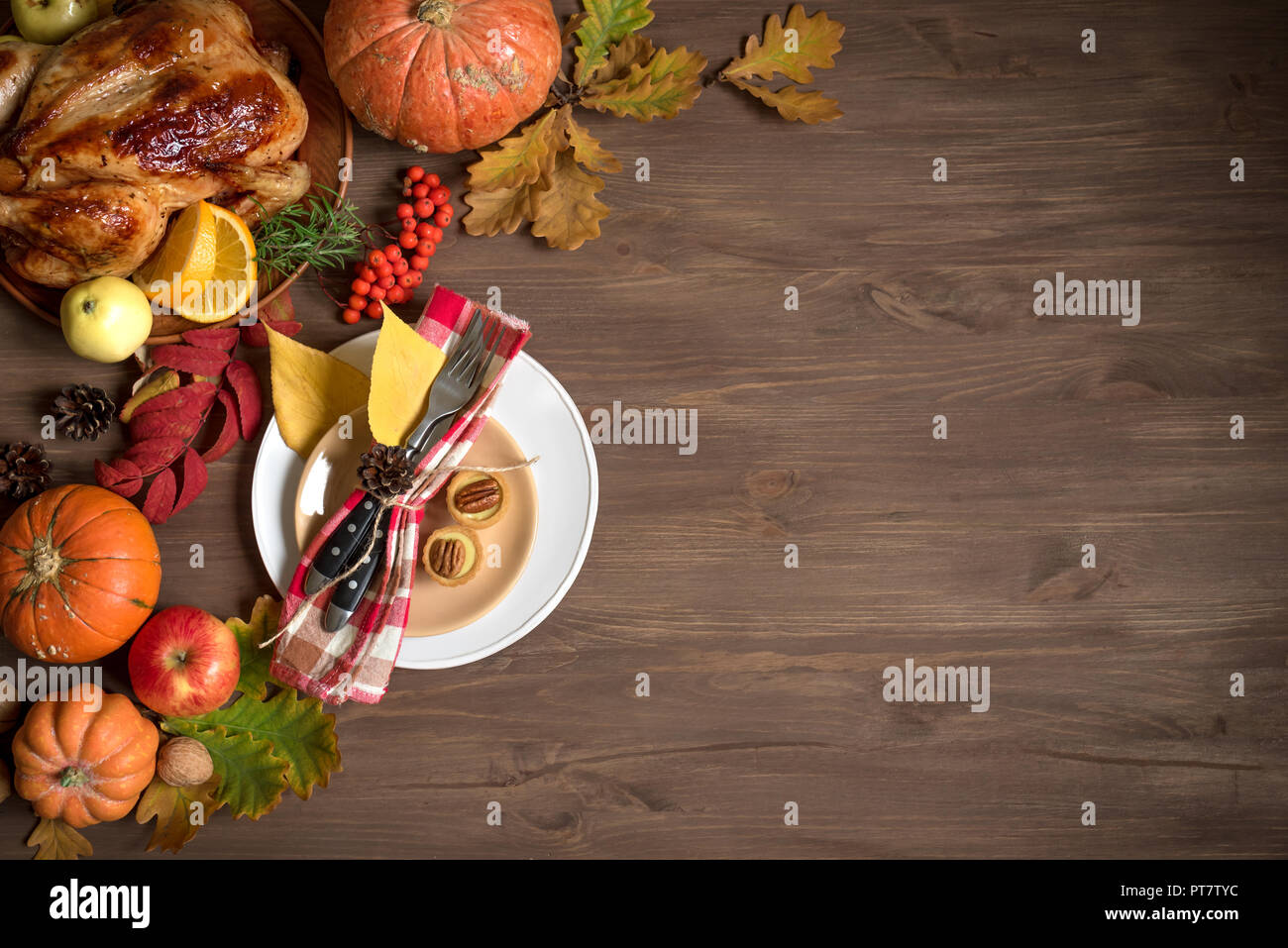 Thanksgiving dinner background with turkey, fall leaves and seasonal ...