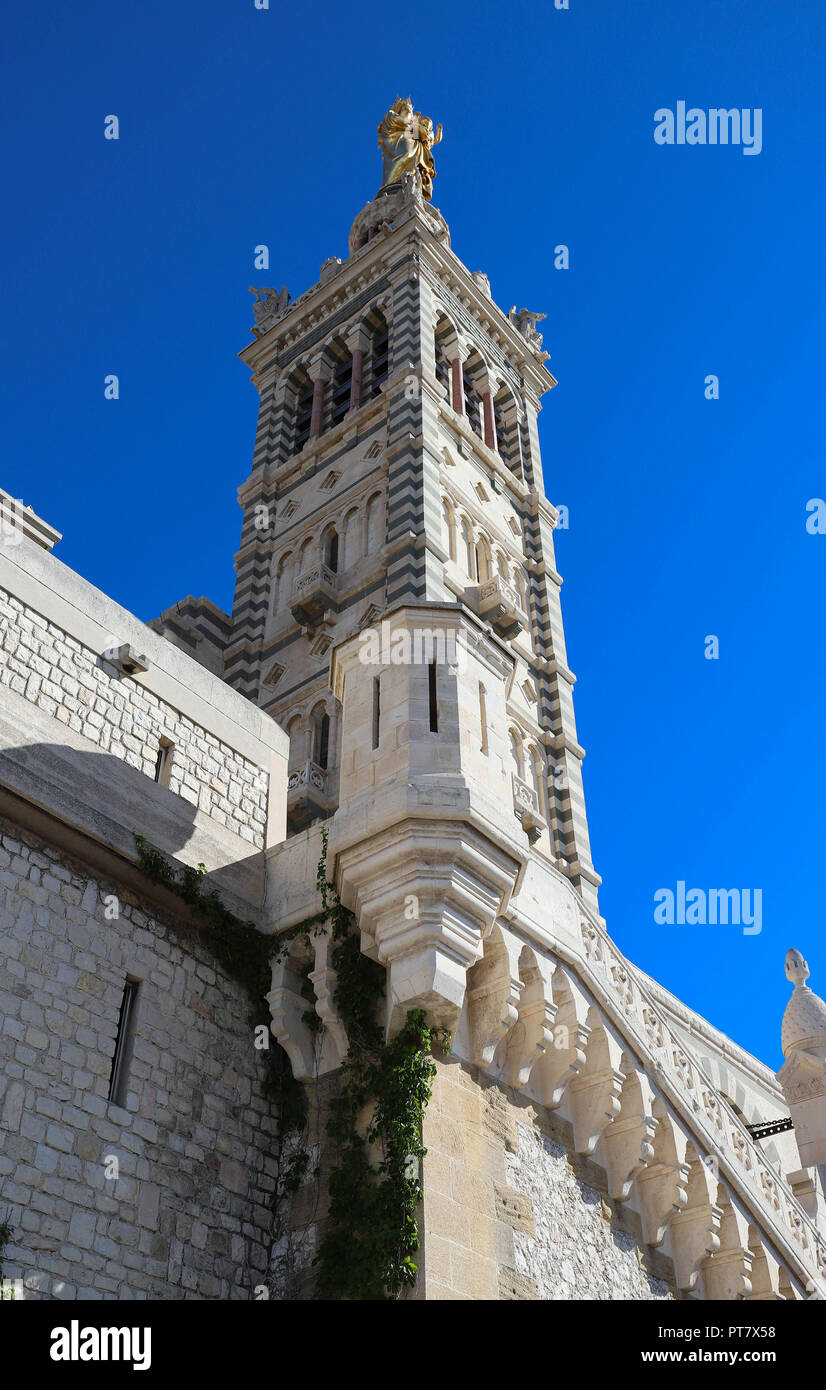 The scenic stone bell tower of Notre Dame de la Garde Basilica ...