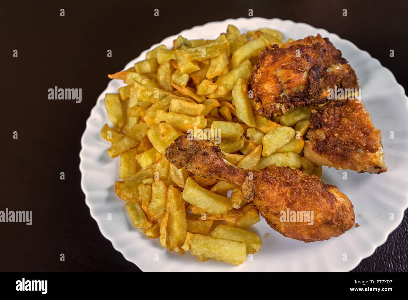 Chicken with french fries Stock Photo - Alamy