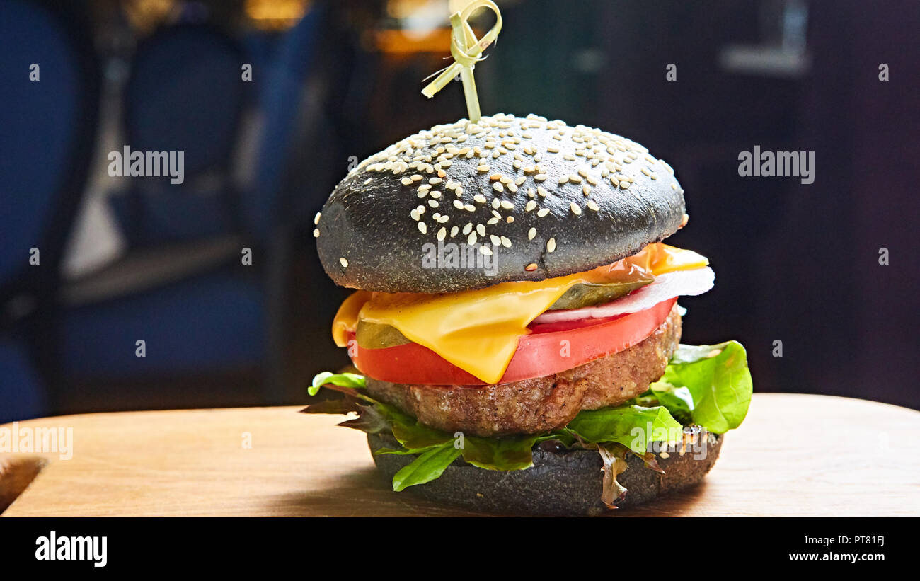 Japanese Black Burger with Cheese. Cheeseburger from Japan with black ...