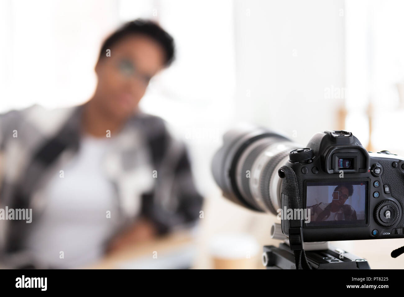 Young black female blogger on camera screen Stock Photo - Alamy