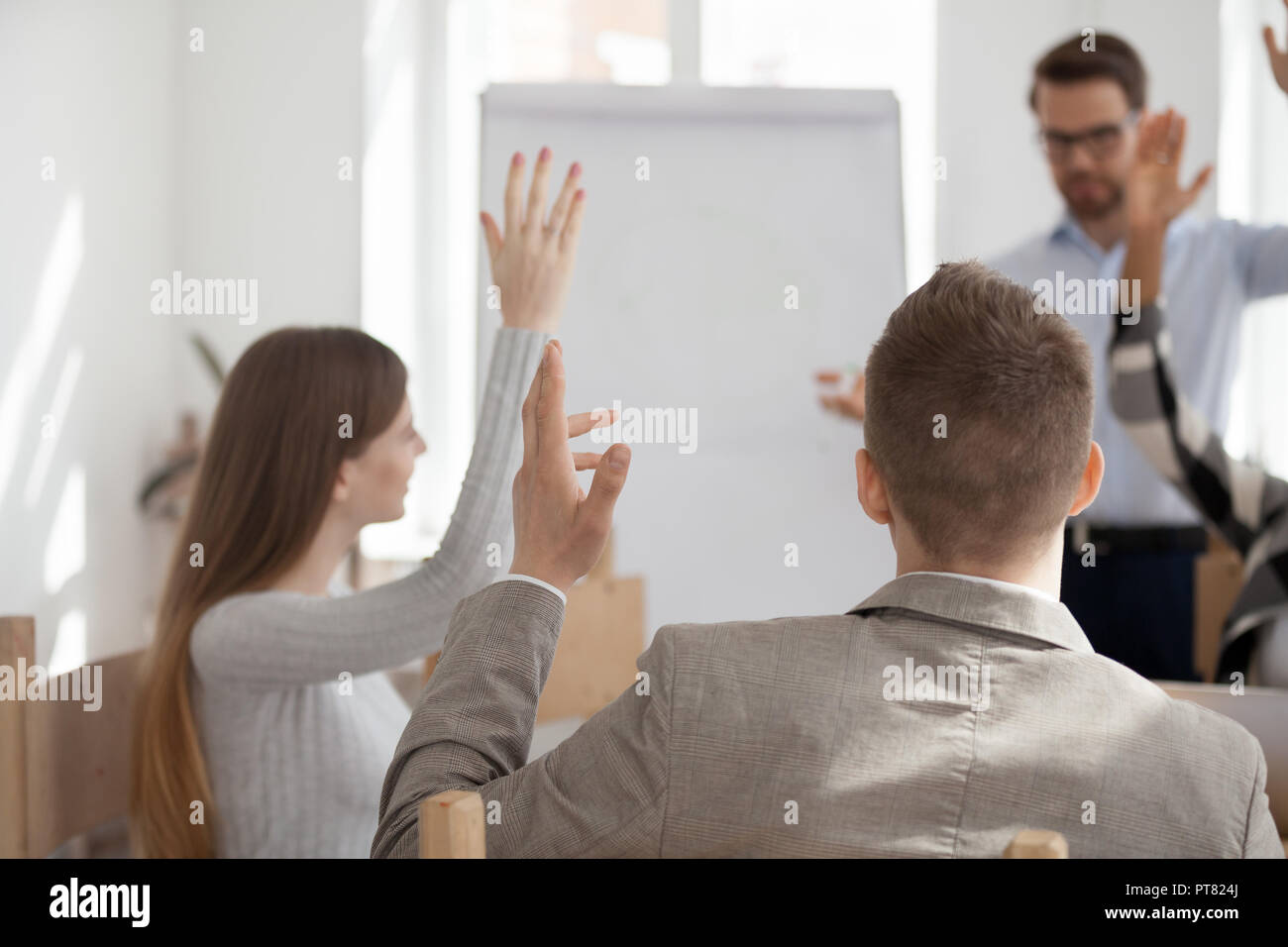 Group of young people at seminar in office Stock Photo - Alamy