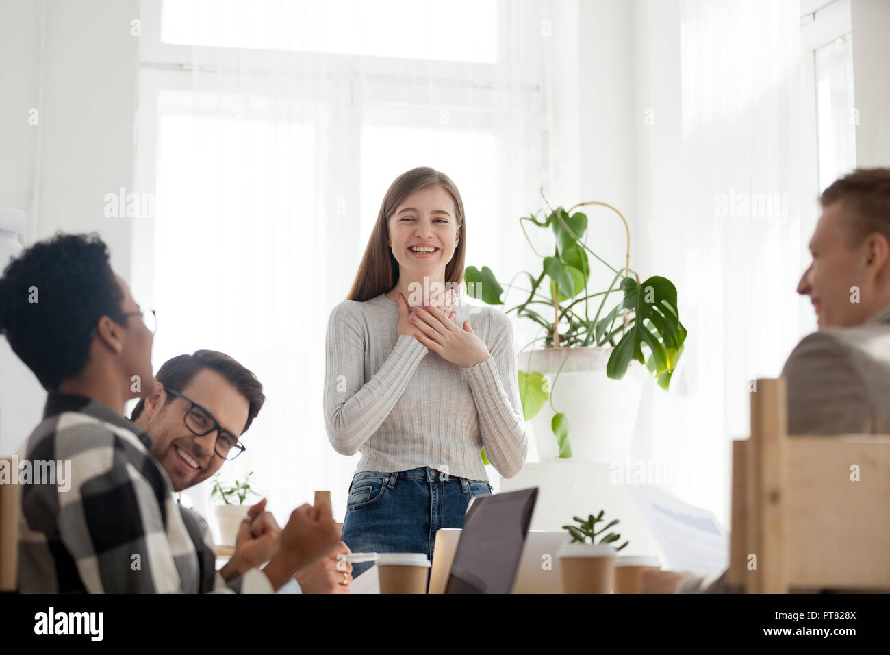 Cheerful young team in office at work Stock Photo - Alamy