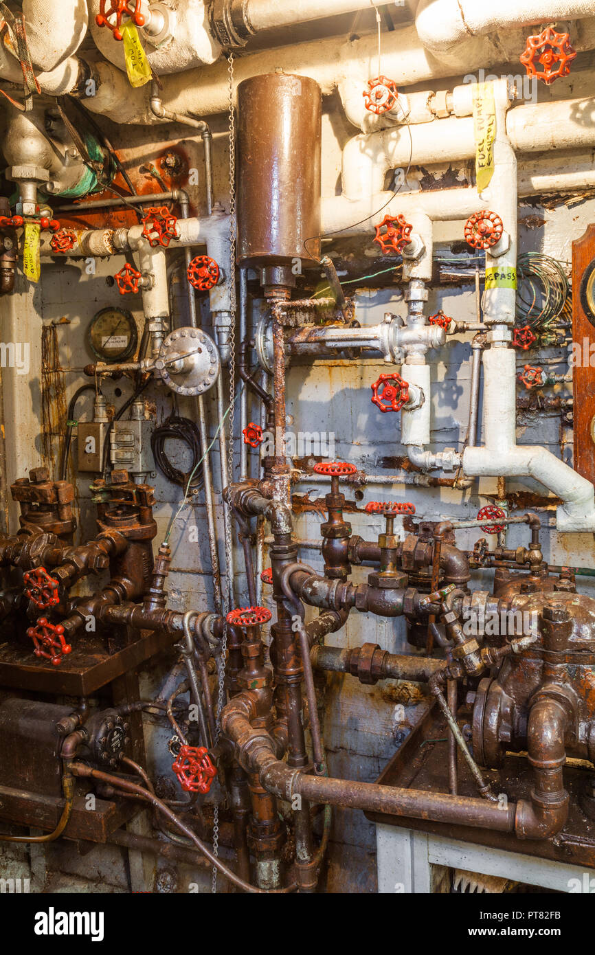 Plumbing network and valve array in the engine room of the steam ...