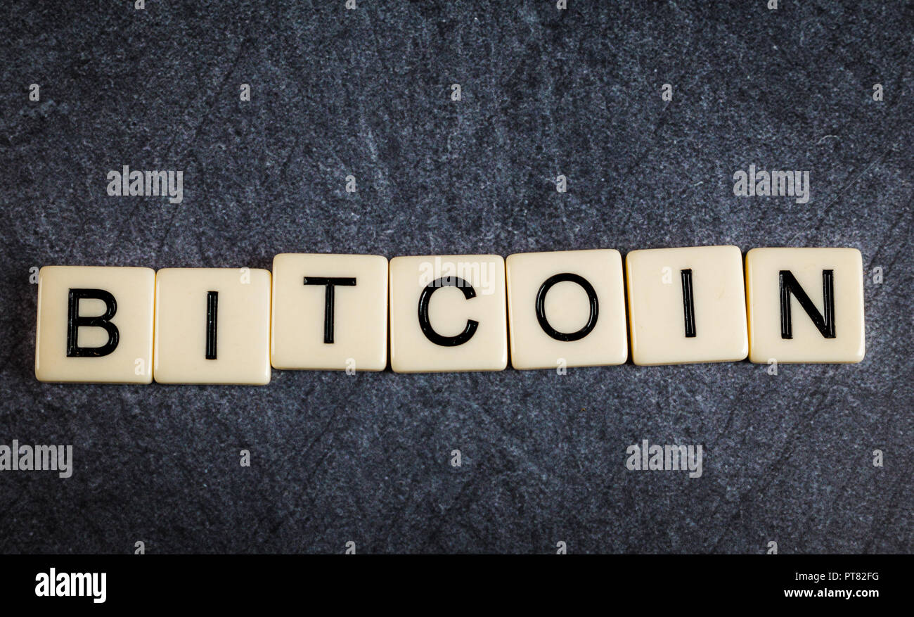 Letter tiles on black slate background spelling Bitcoin Stock Photo - Alamy