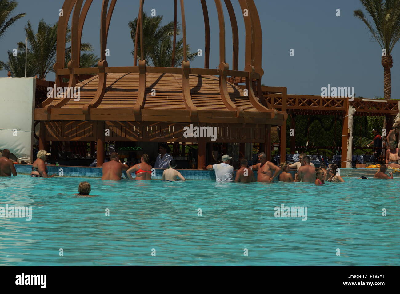 all inclusive hotel with blue swimmingpool and bar into the pool great ...