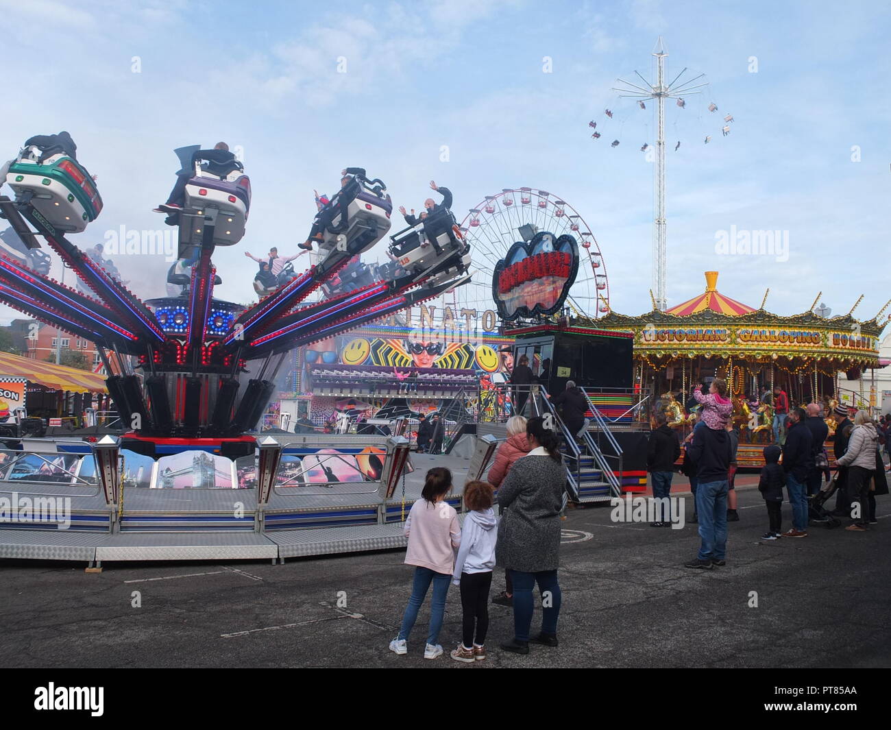General perspective of Nottingham Goose Fair showing rides including a ...