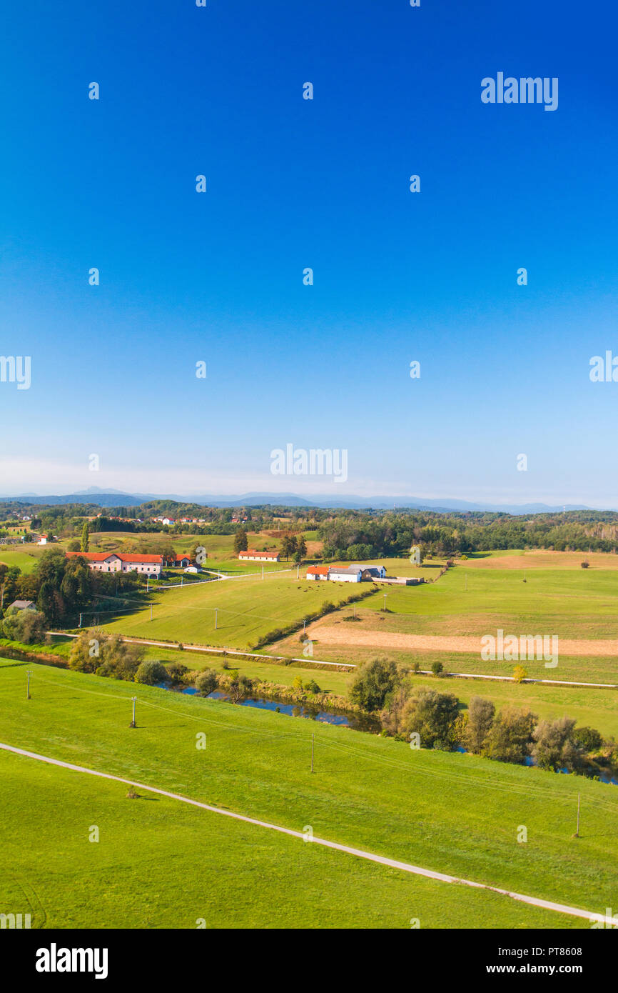 Croatian farmlands in countryside, panoramic view of river Dobra in ...