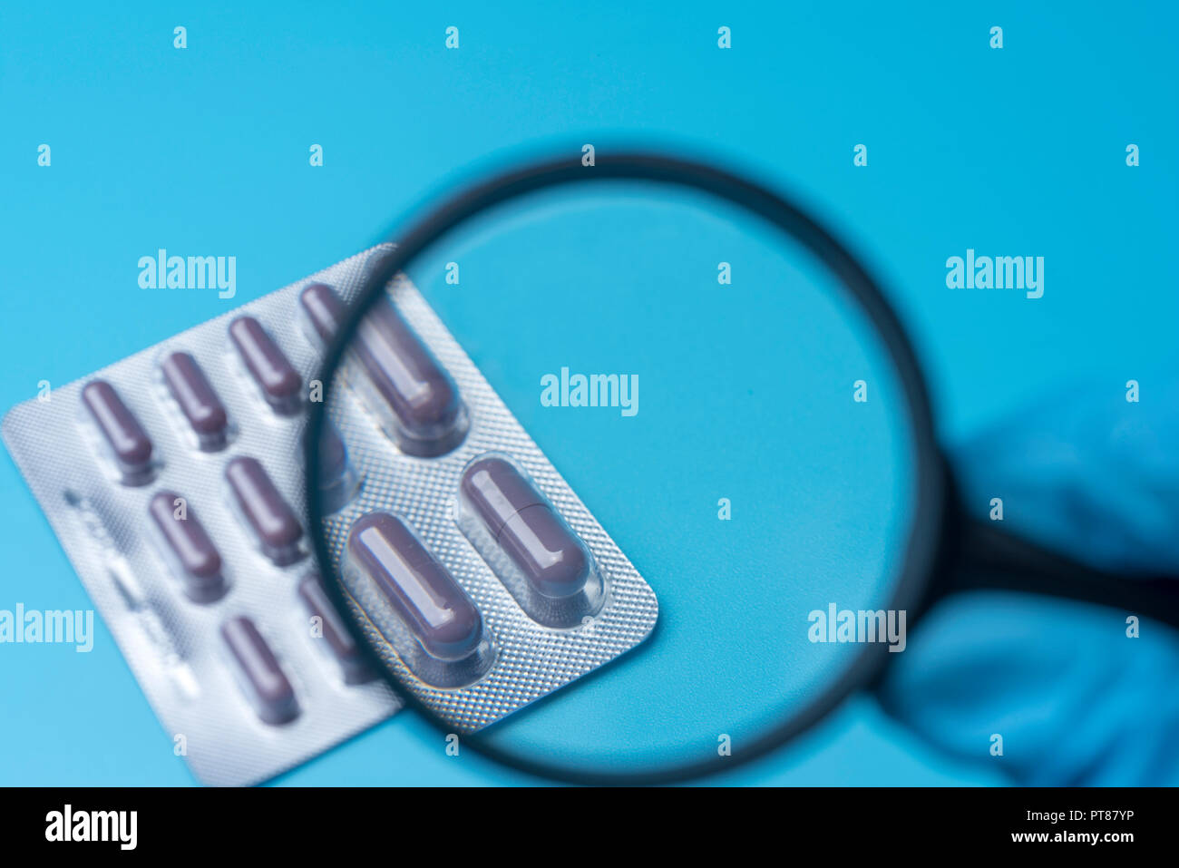 Magnifying glass and bottle hi-res stock photography and images - Alamy