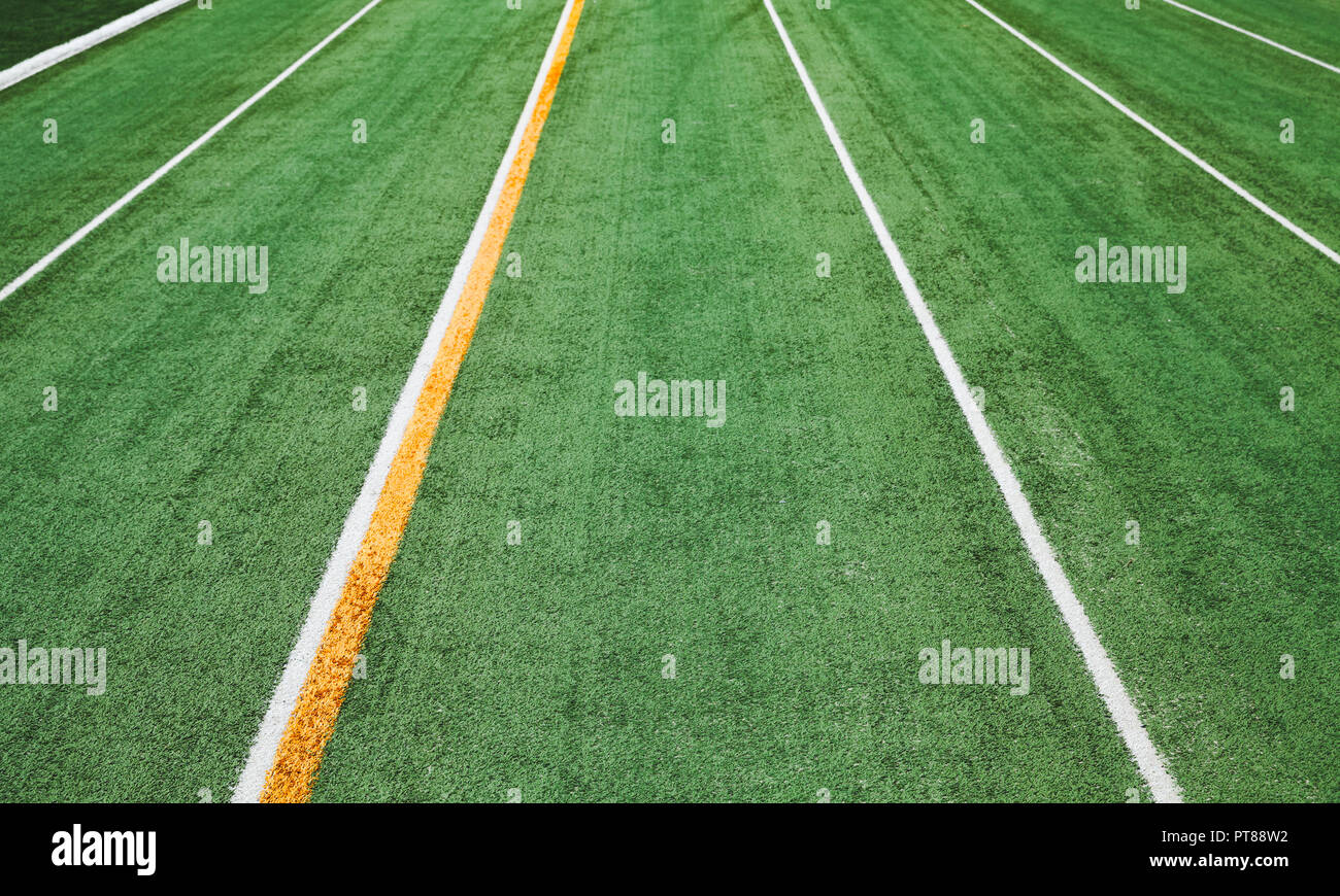 Empty running track background with artificial turf field and border ...