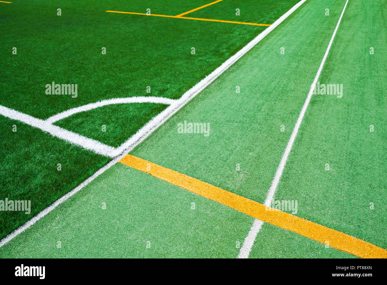 Soccer field border with an artificial turf field and white corner ...
